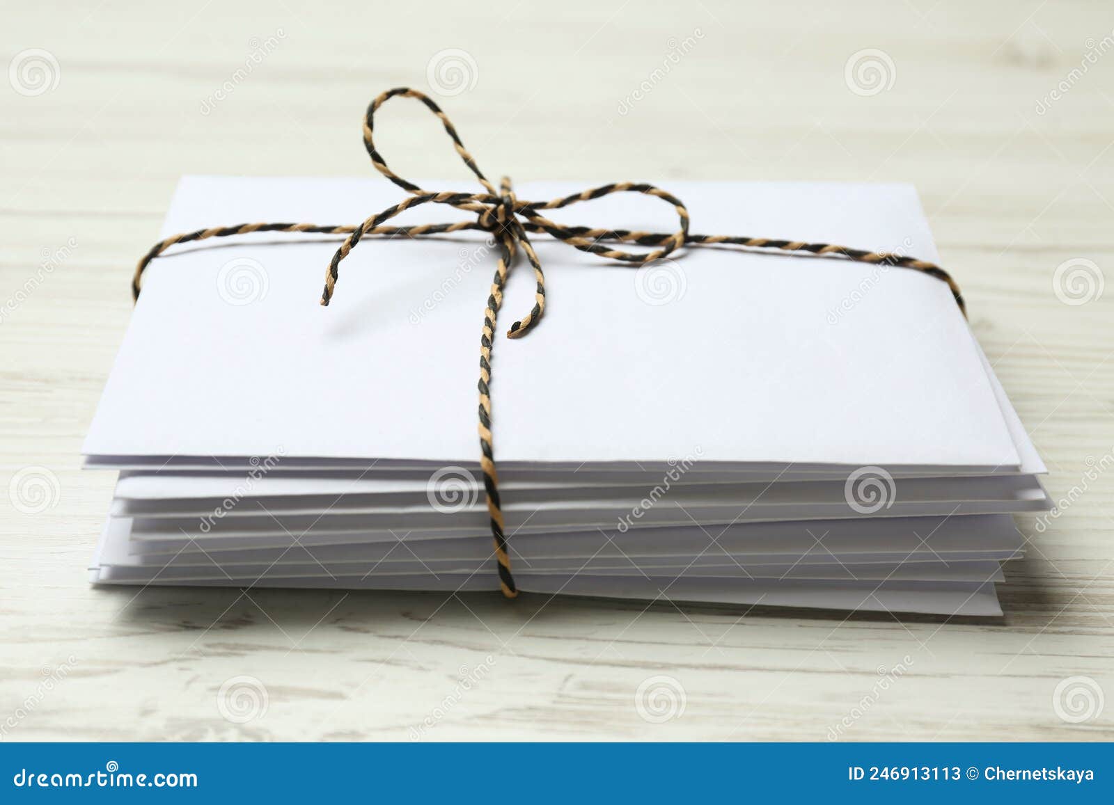 Stack of Letters Tied with String on White Wooden Table, Closeup Stock ...