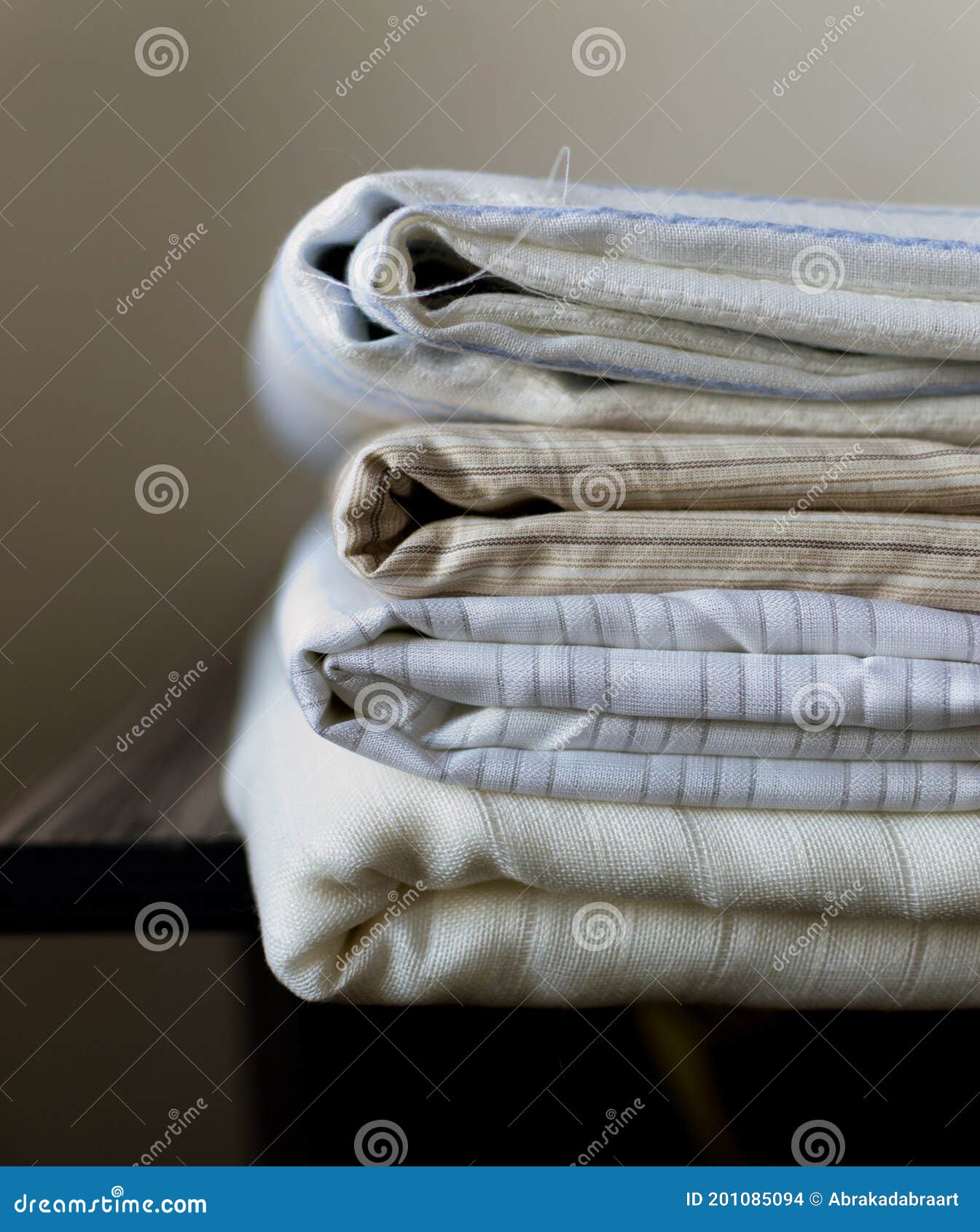 Stack of Light Colored Sewing Cotton Fabrics on Edge of Table Stock ...