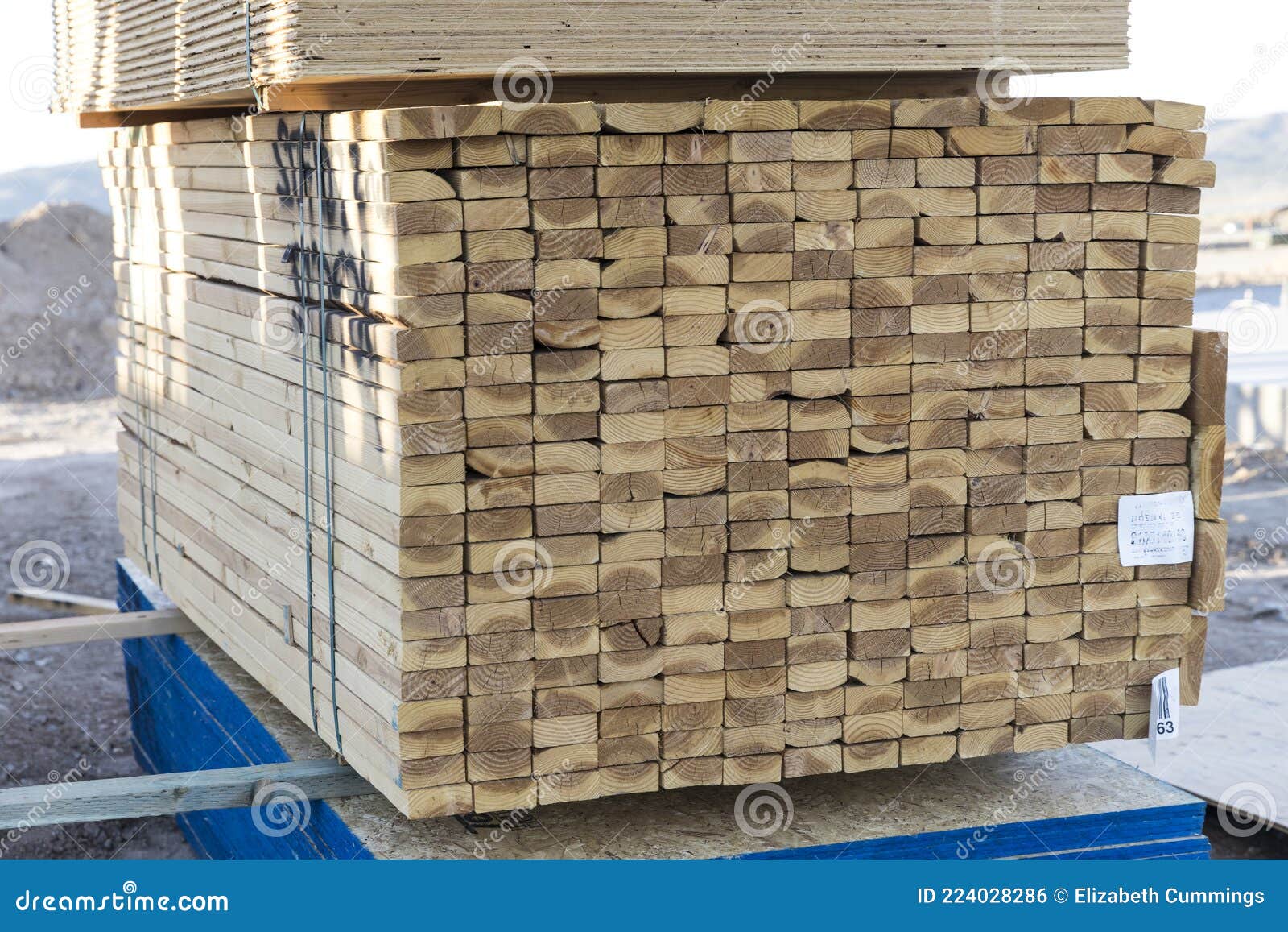 Stack of Lumber Pieces Strapped Together on a Construction Site Stock ...