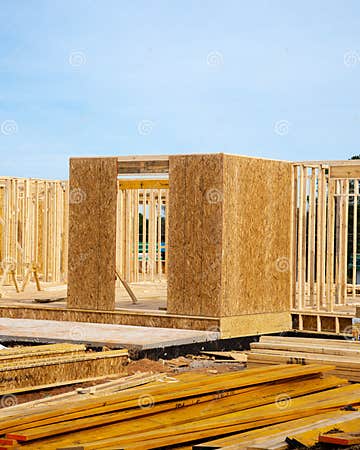 Stack of Lumbers in Front of Timber Frame House with Post, Beam, OSB ...