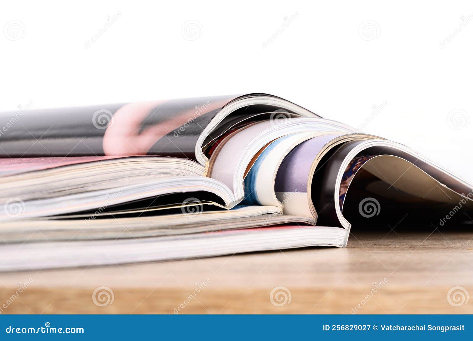 Stack of Magazines on Wooden Table Isolated on White Background Stock ...