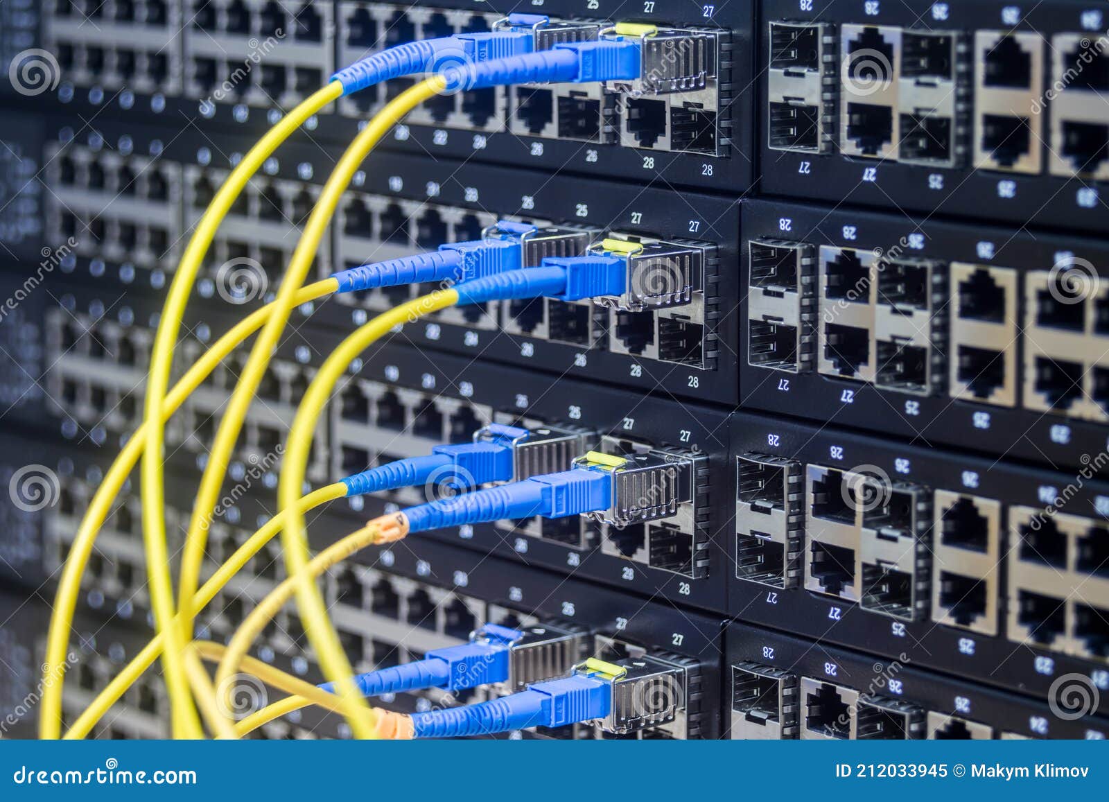 A Stack of Managed Internet Switches is Connected by Fiber Optic Cables ...