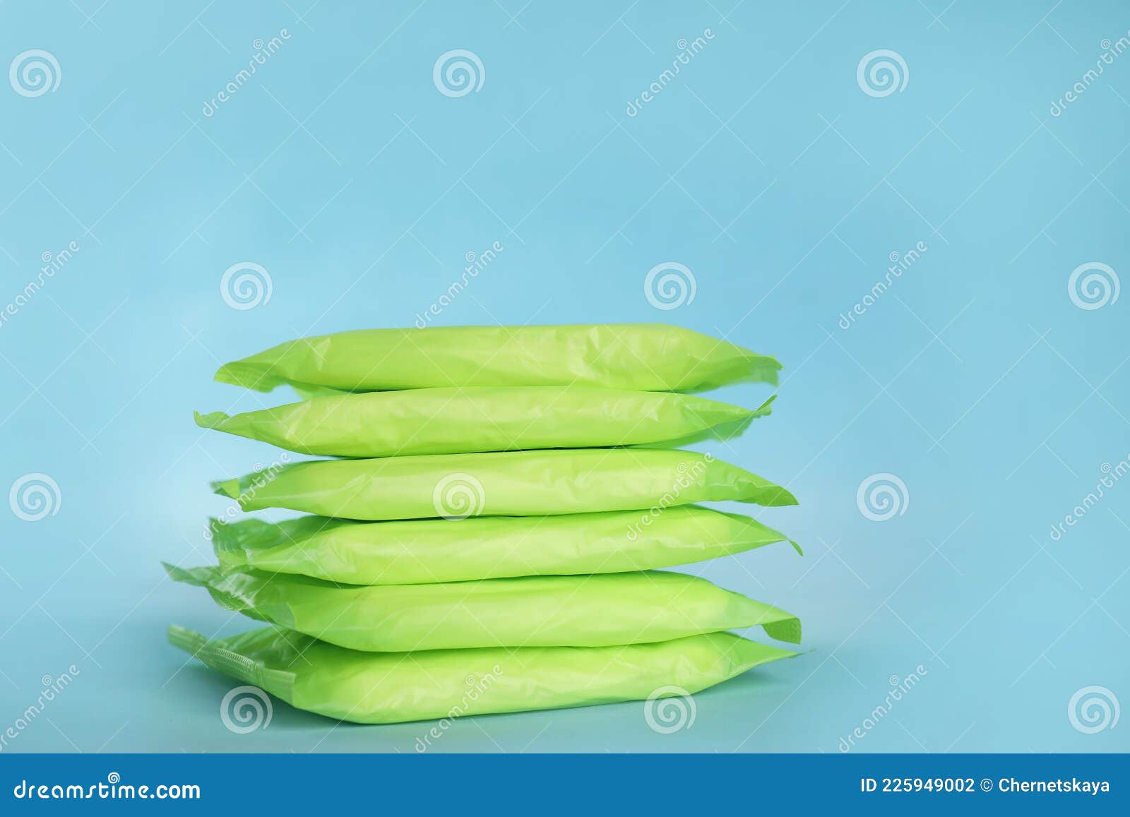 Stack Of Menstrual Pads On Blue Background Royalty-Free Stock Photo ...