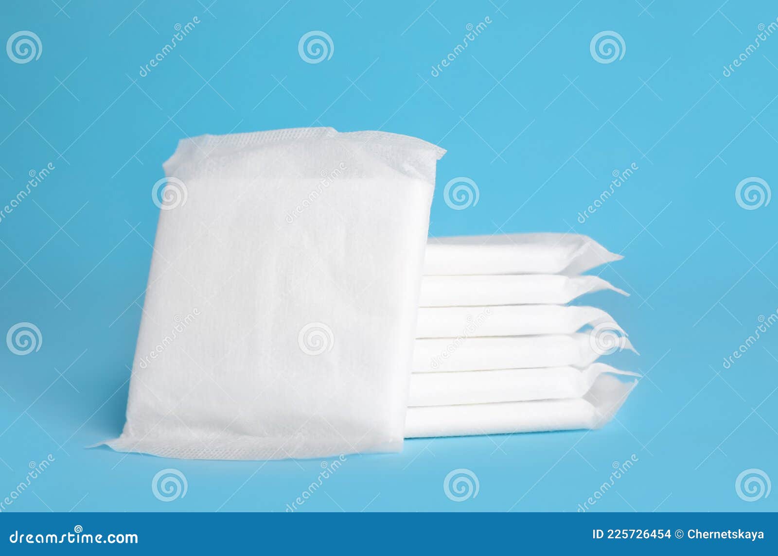 Stack Of Menstrual Pads On Light Blue Background Royalty-Free Stock ...