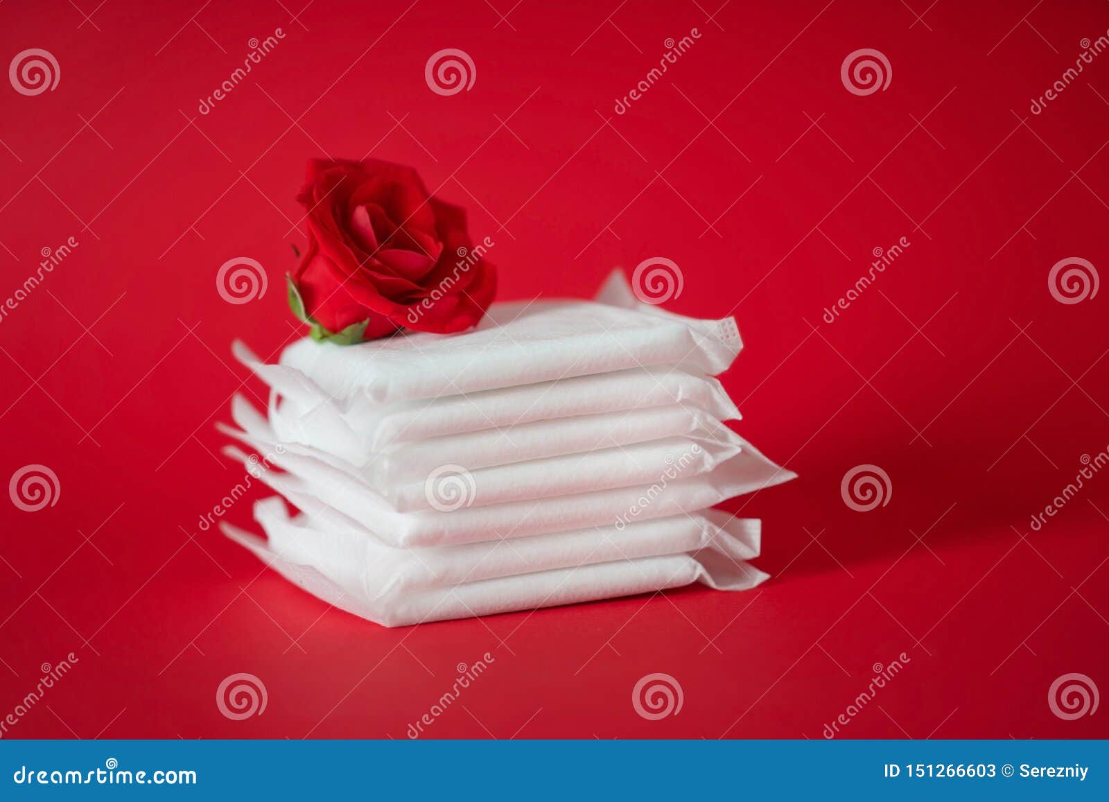 Stack of Menstrual Pads with Red Rose on Color Background Stock Image ...