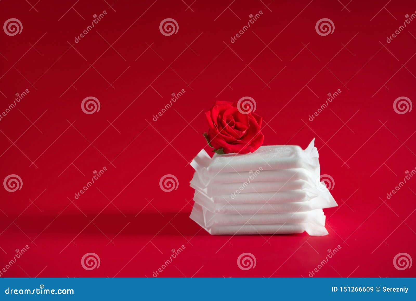 Stack Of Menstrual Pads With Red Rose On Color Background Royalty-Free ...