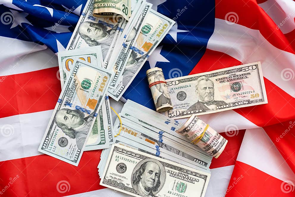 Stack of Money on American Flag. Dollars. Stock Photo - Image of ...