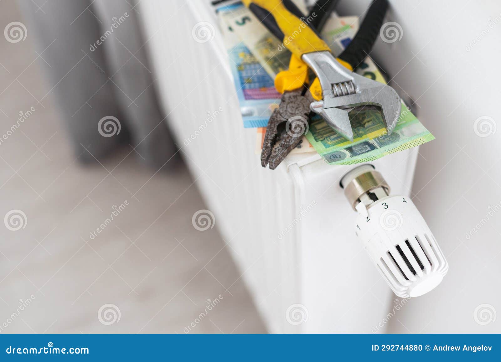 A Stack of Money on the Background of the Radiator. Expensive Utilities ...