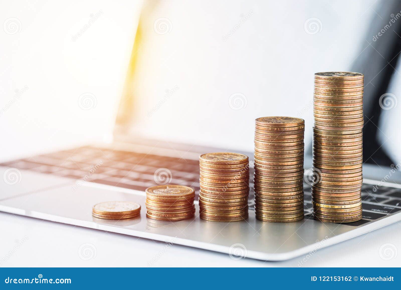 Stack of Money Coins on Laptop Computer Background Stock Photo - Image ...