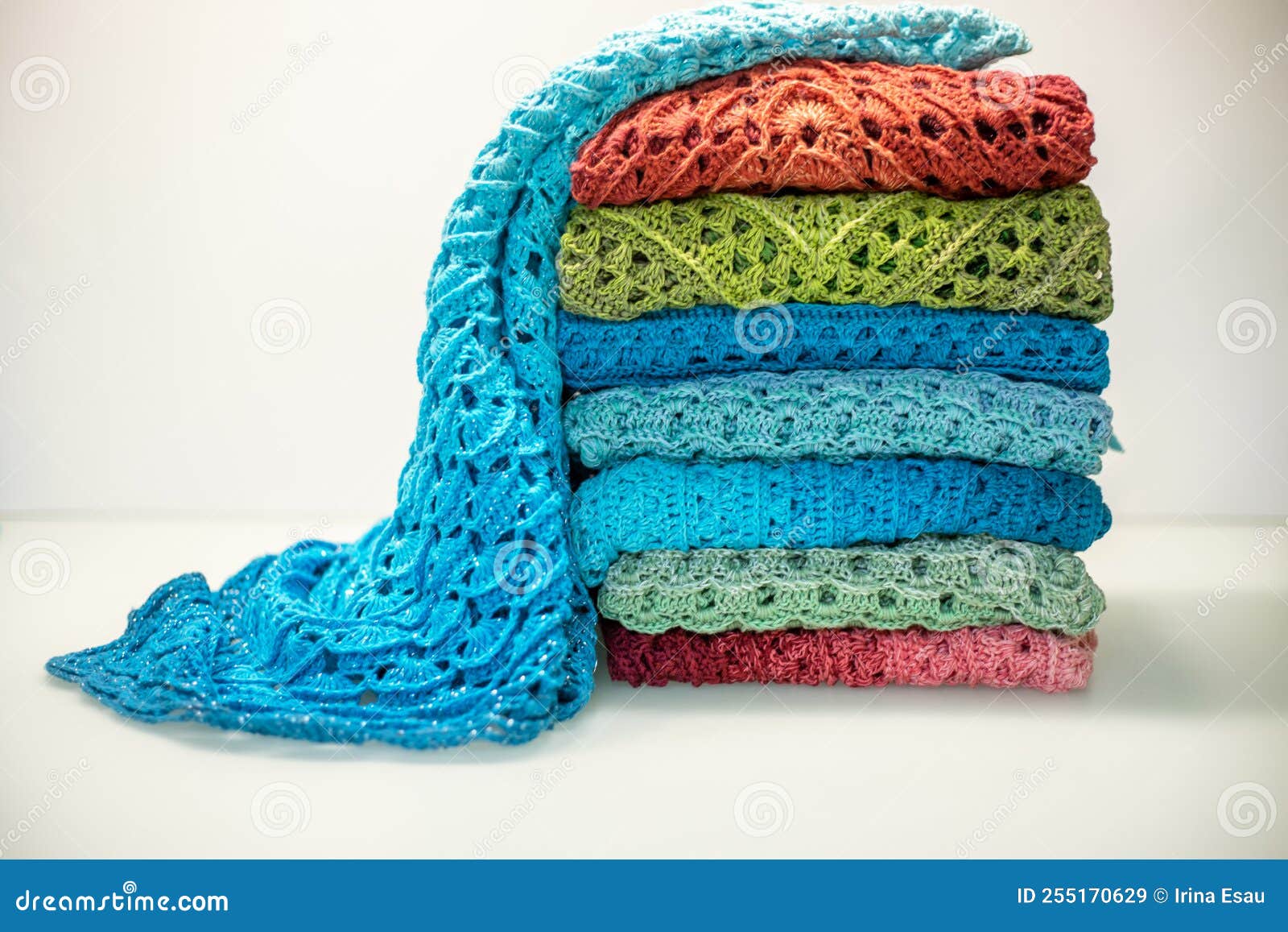 A Stack of Multi-colored Knitted Things on a White Background Stock ...