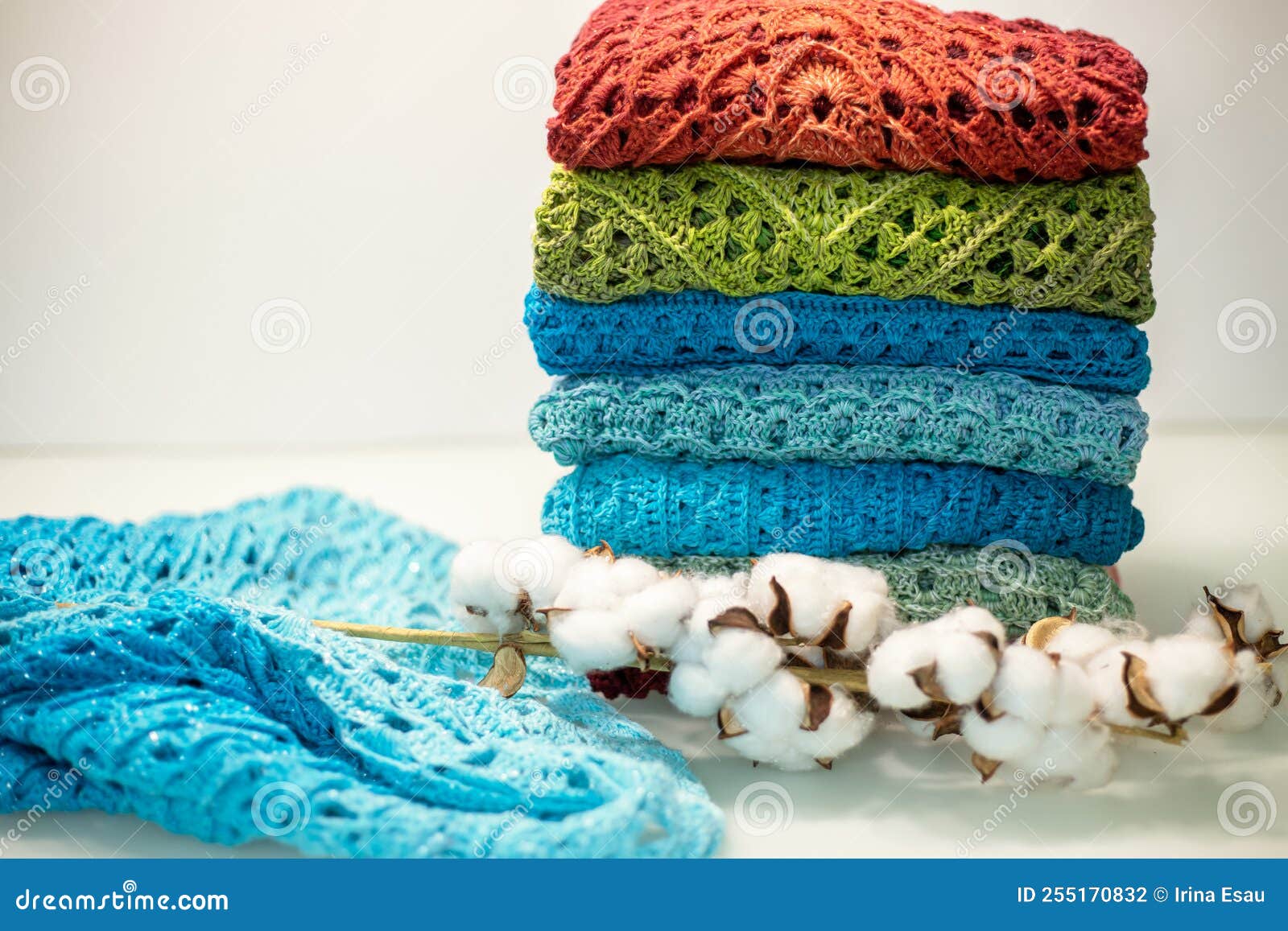 A Stack of Multi-colored Knitted Things on a White Background Stock ...