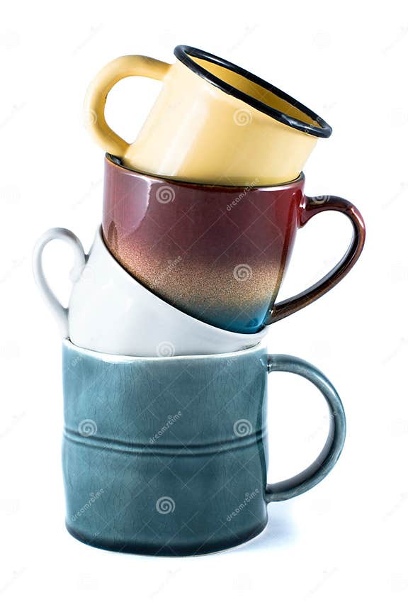 Stack of Multicolored Ceramic and Metal Mugs and Cups on White ...