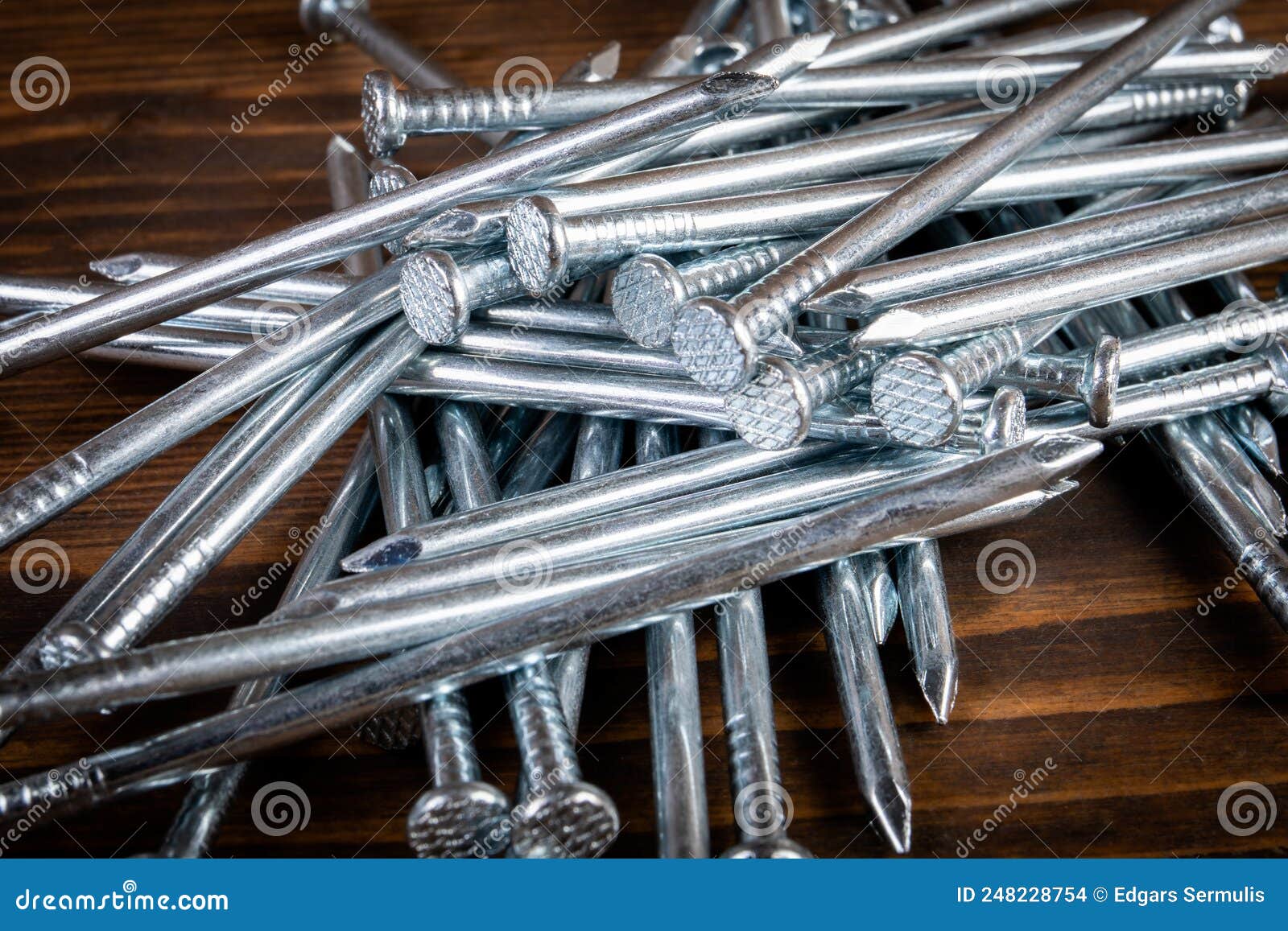 Stack with Nails on a Dark Wood Texture Background. Close-up Stock ...