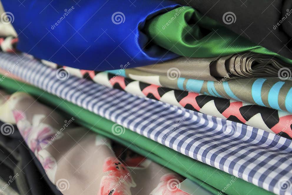 A Stack of Natural Silk Fabrics of Different Colors and Textures. Stock ...