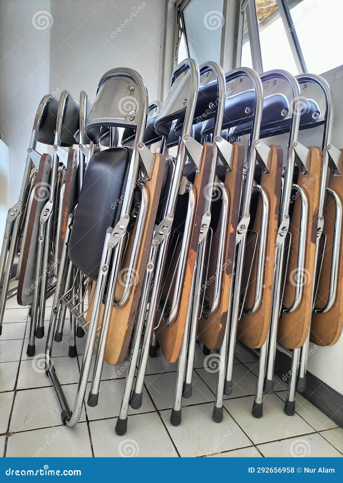 A Stack of Neatly Folded Study Chairs Stock Photo - Image of folded ...