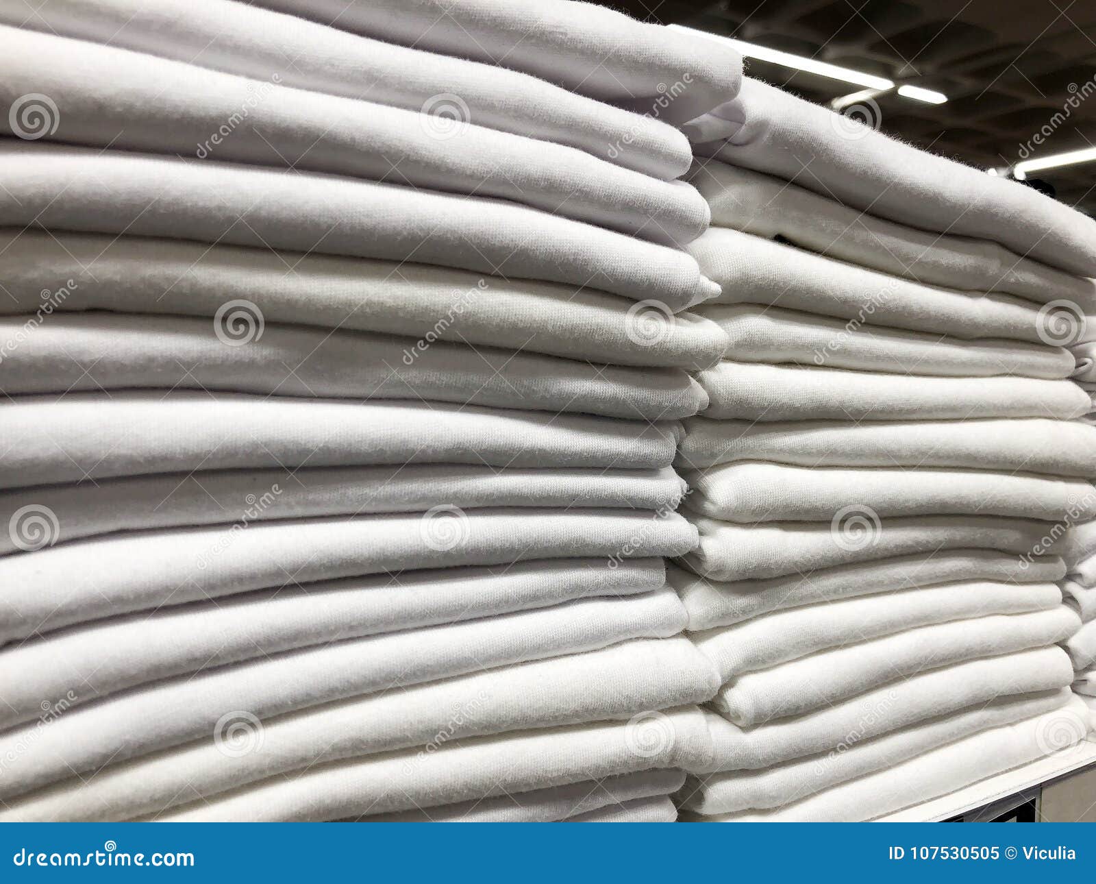 Stack of Neatly Folded Clothes on the Counter of the Store Stock Image ...