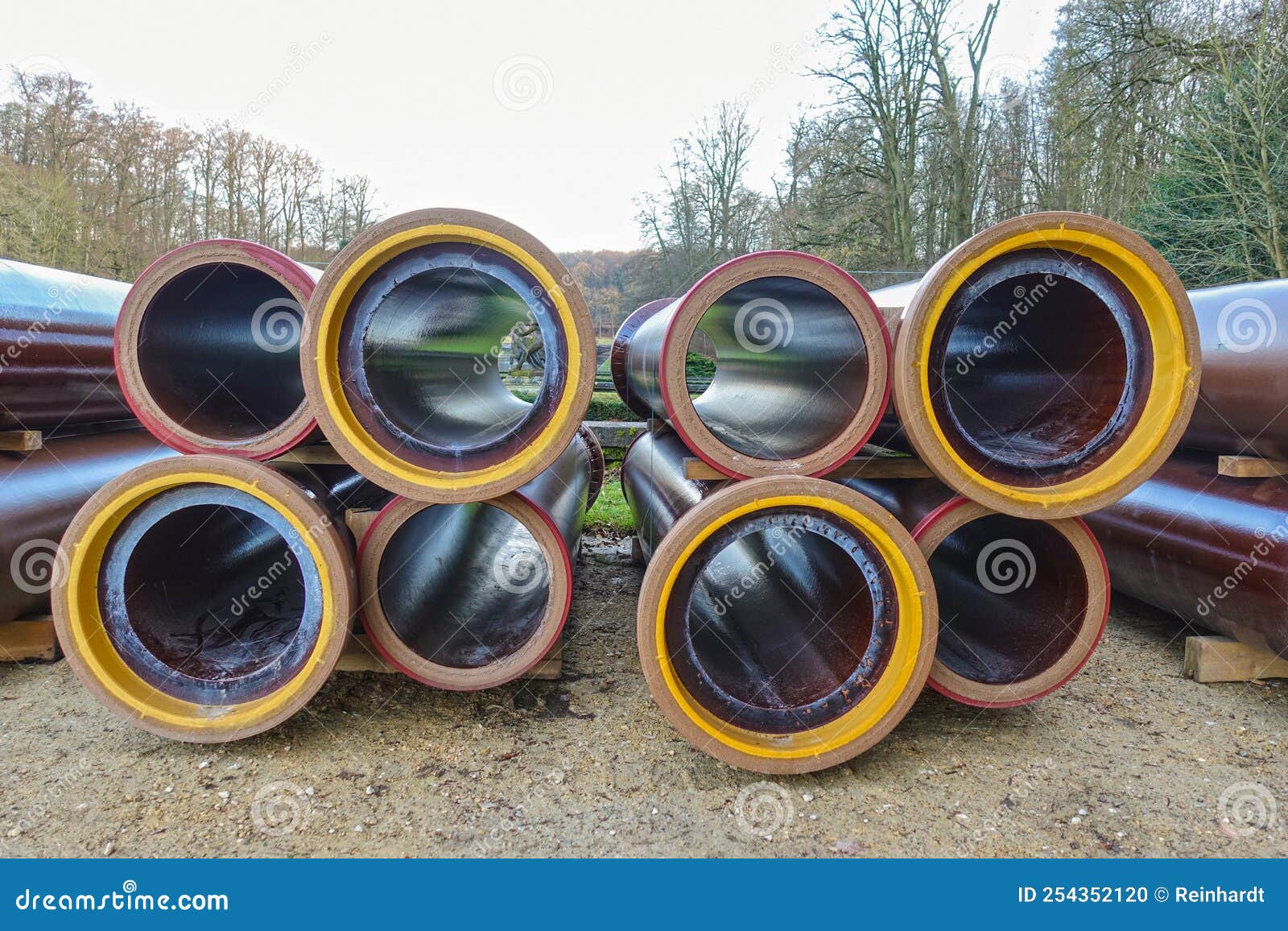 Stack of Long Ceramic Pipes for the Construction of a Water Pipeline ...
