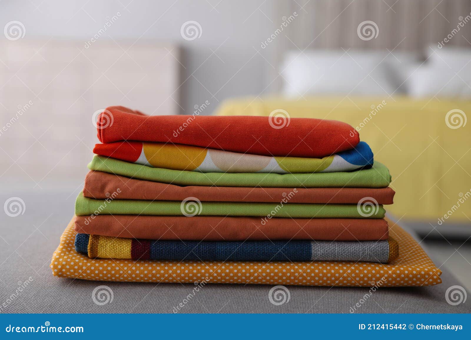 Stack of New Clean Folded Bed Linens on Bench Stock Photo - Image of ...