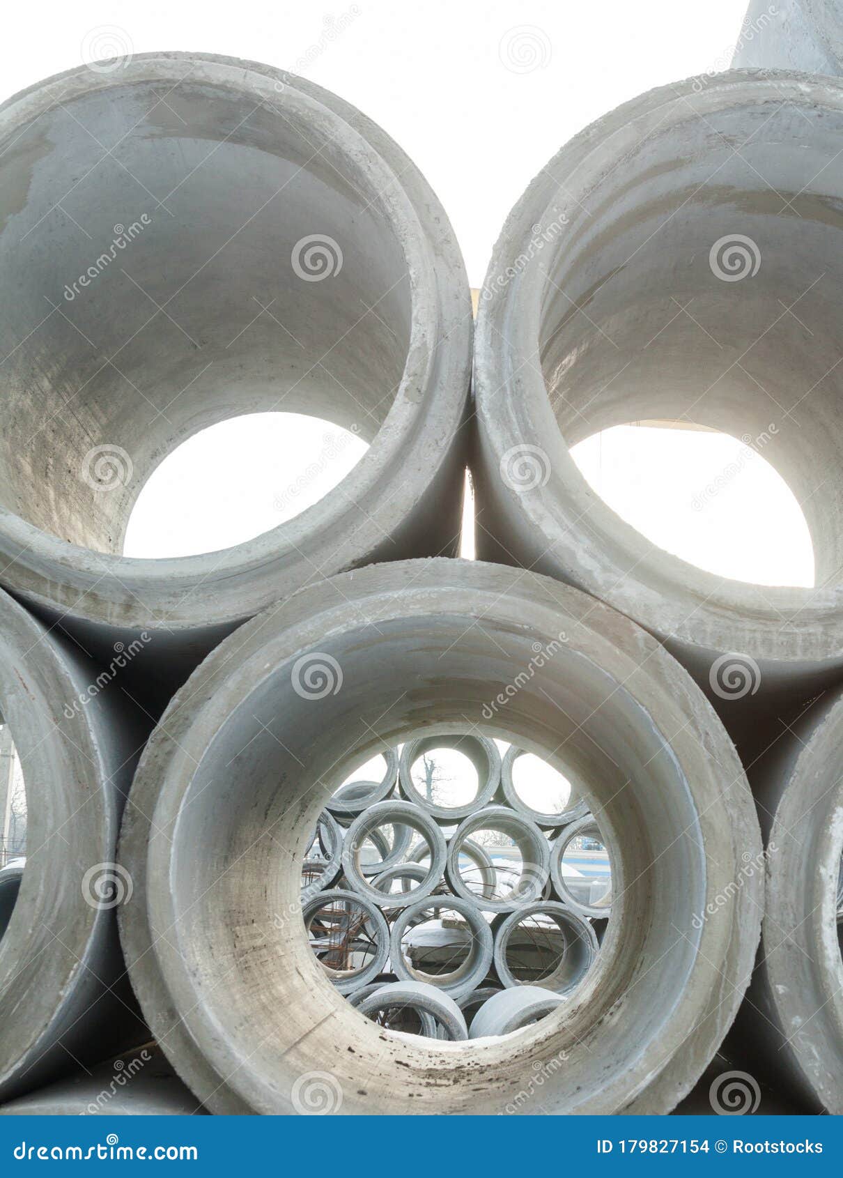 Stack of New Concrete Pipes Stock Photo - Image of conduit, gray: 179827154
