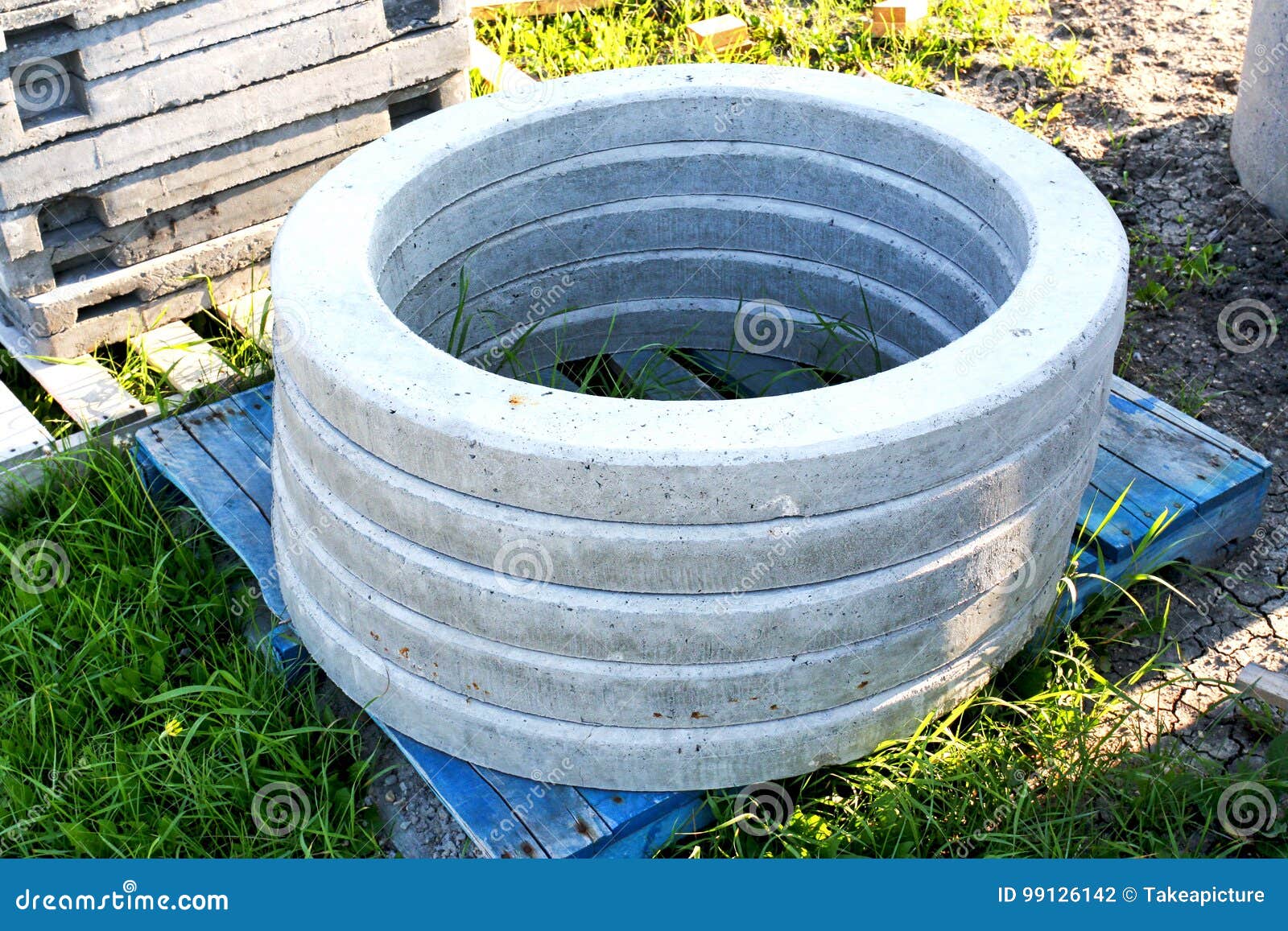 A Stack of New Concrete Rings Stock Photo - Image of drain ...