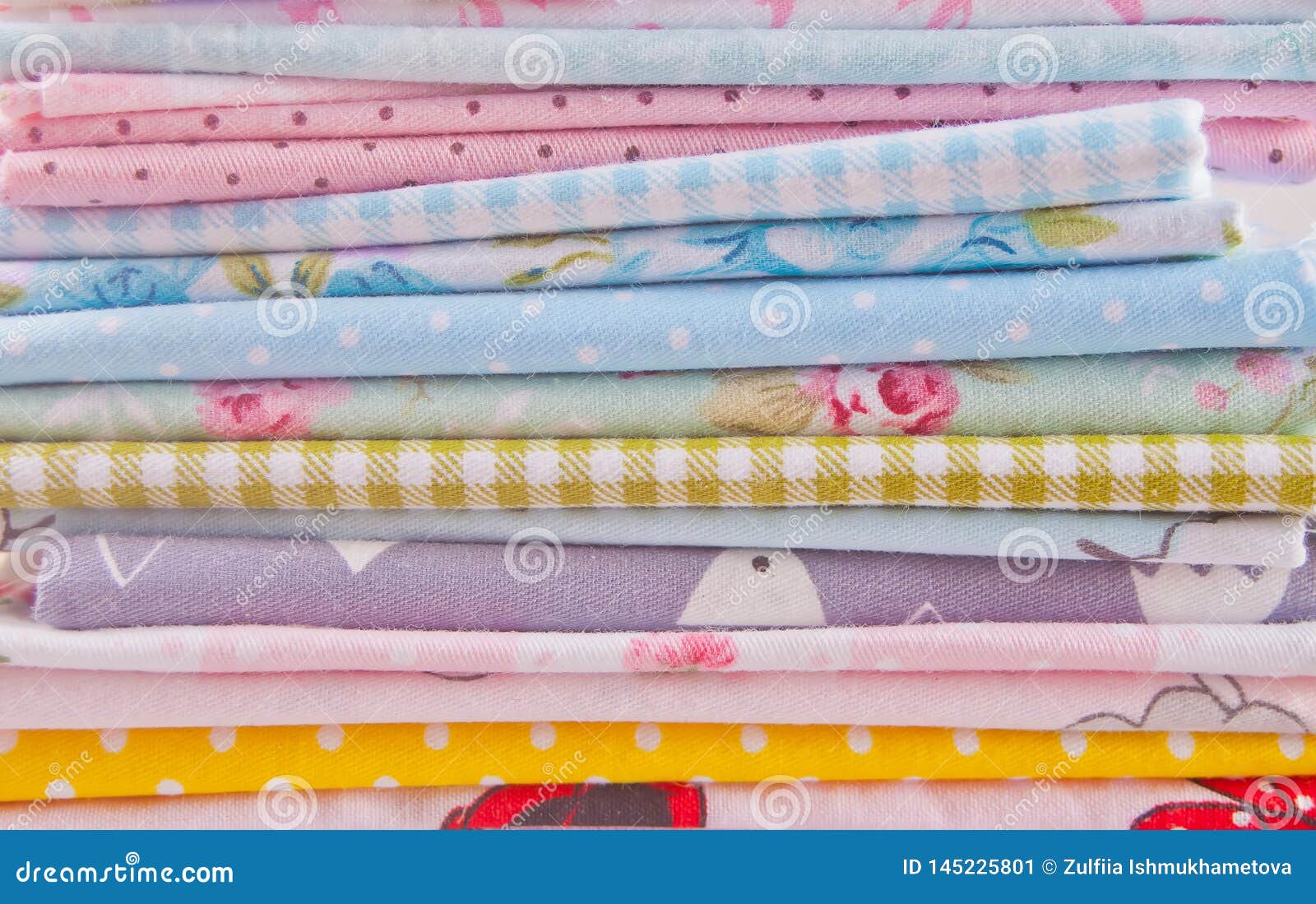 Stack of of New Fabrics in Different Colors Cloth on the Wooden Table ...