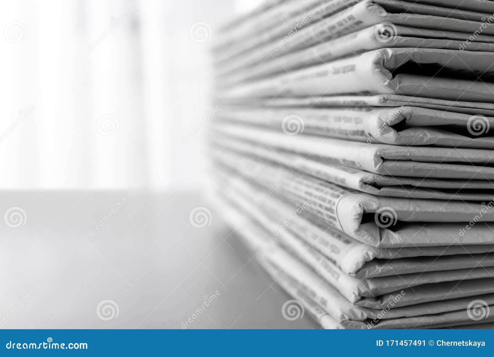 Stack of Newspapers on Grey Table, Space for Text. Journalist`s Work ...