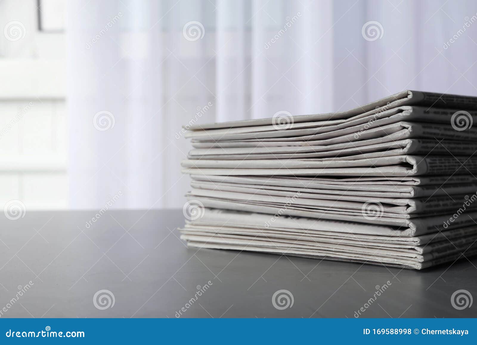 Stack of Newspapers on Grey Table, Space for Text. Journalist`s Work ...
