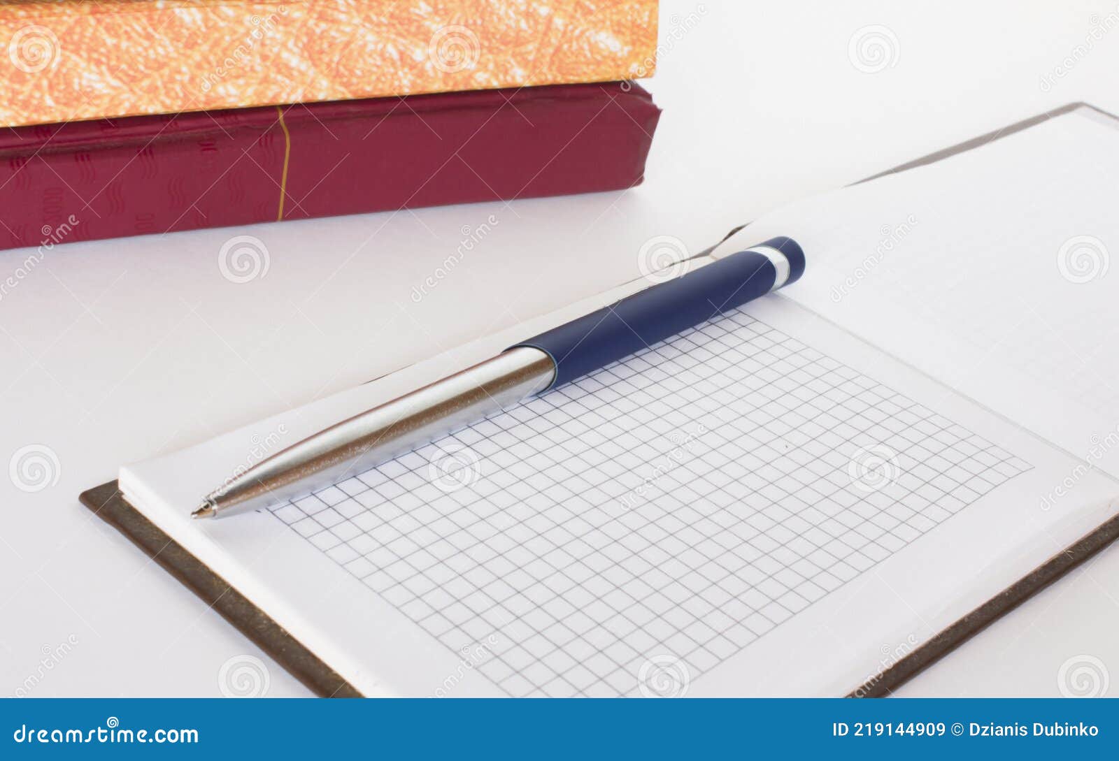 Stack of Notebooks and Open Notepad with Pen White Background Stock ...