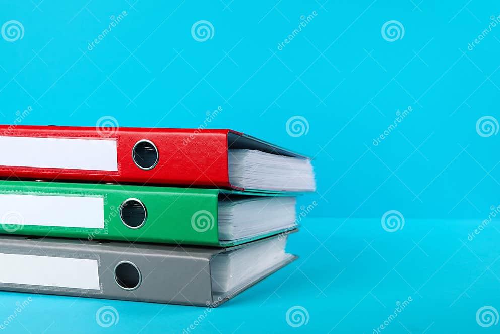 Stack of Office Folders on Light Blue Background, Space for Text Stock ...
