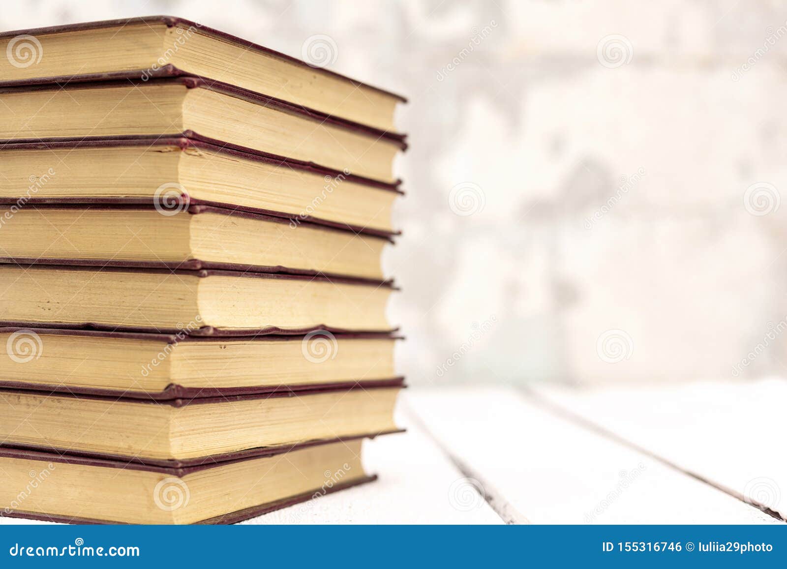 Stack of Old Ancient Shabby Books on a White Wooden Background Stock ...