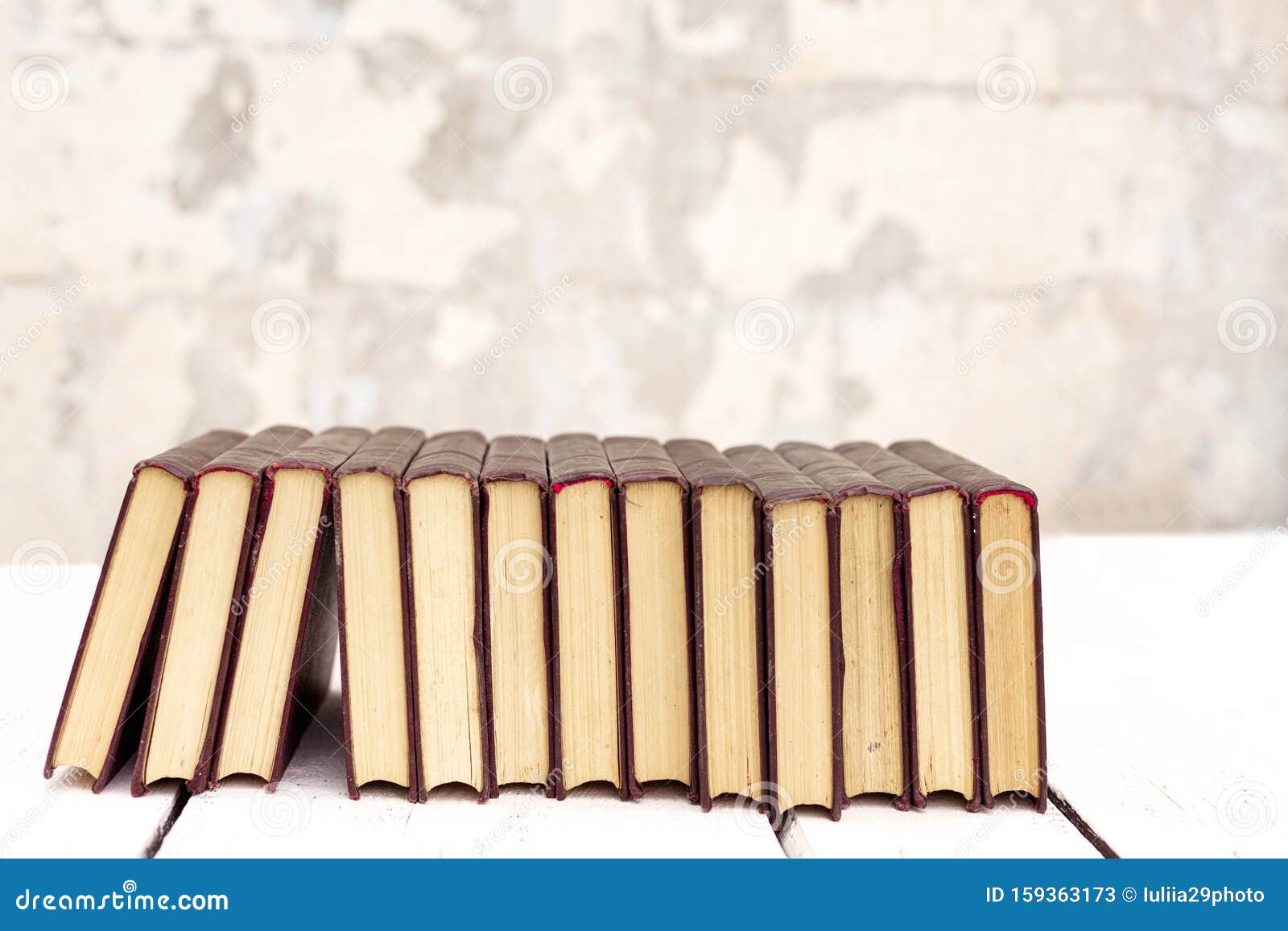Stack of Old Ancient Shabby Books on a White Wooden Background Stock ...