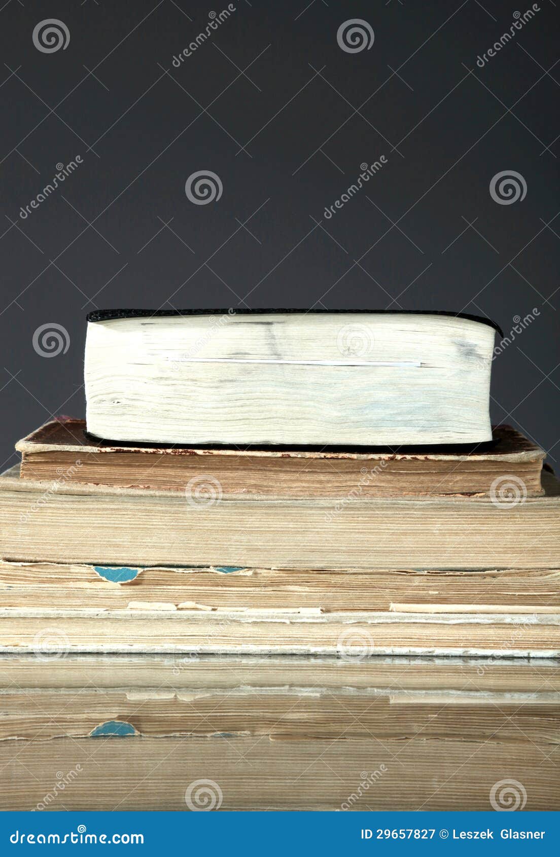 Stack of old books on dark stock image. Image of literature - 29657827