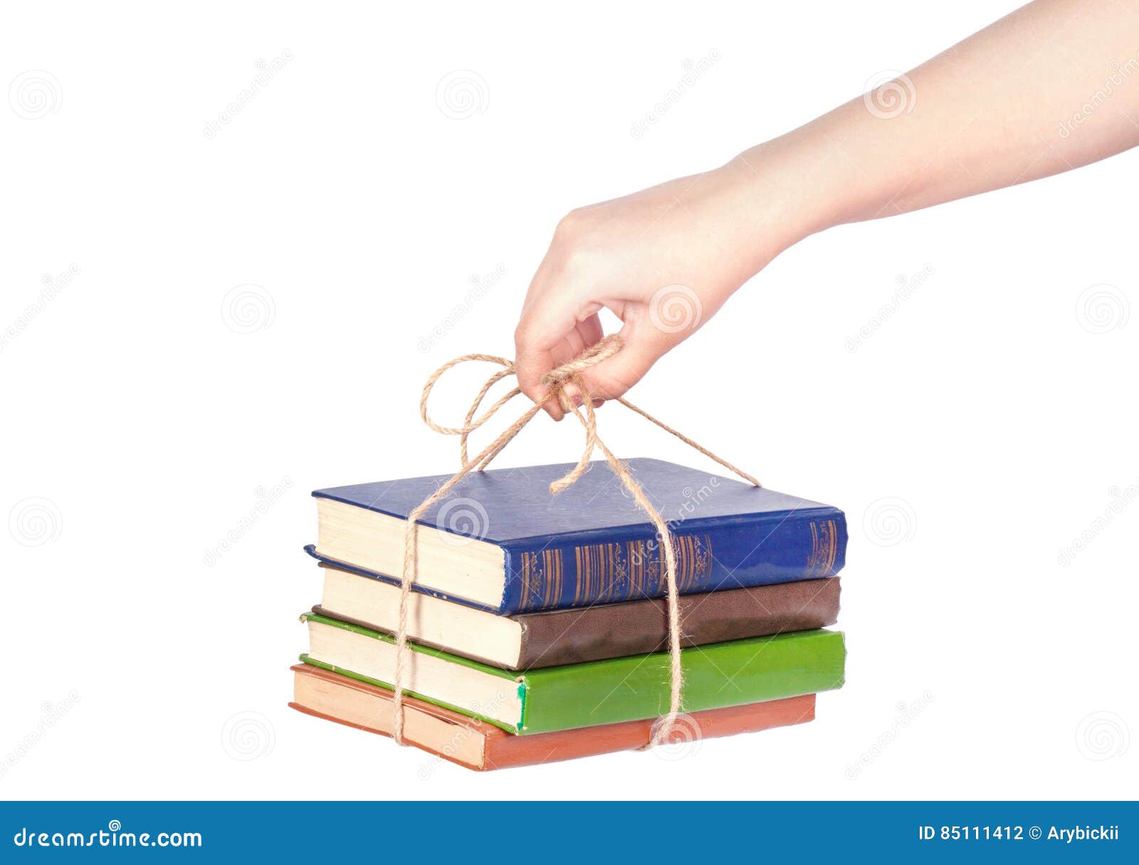 Stack of old books in hand stock photo. Image of vintage - 85111412