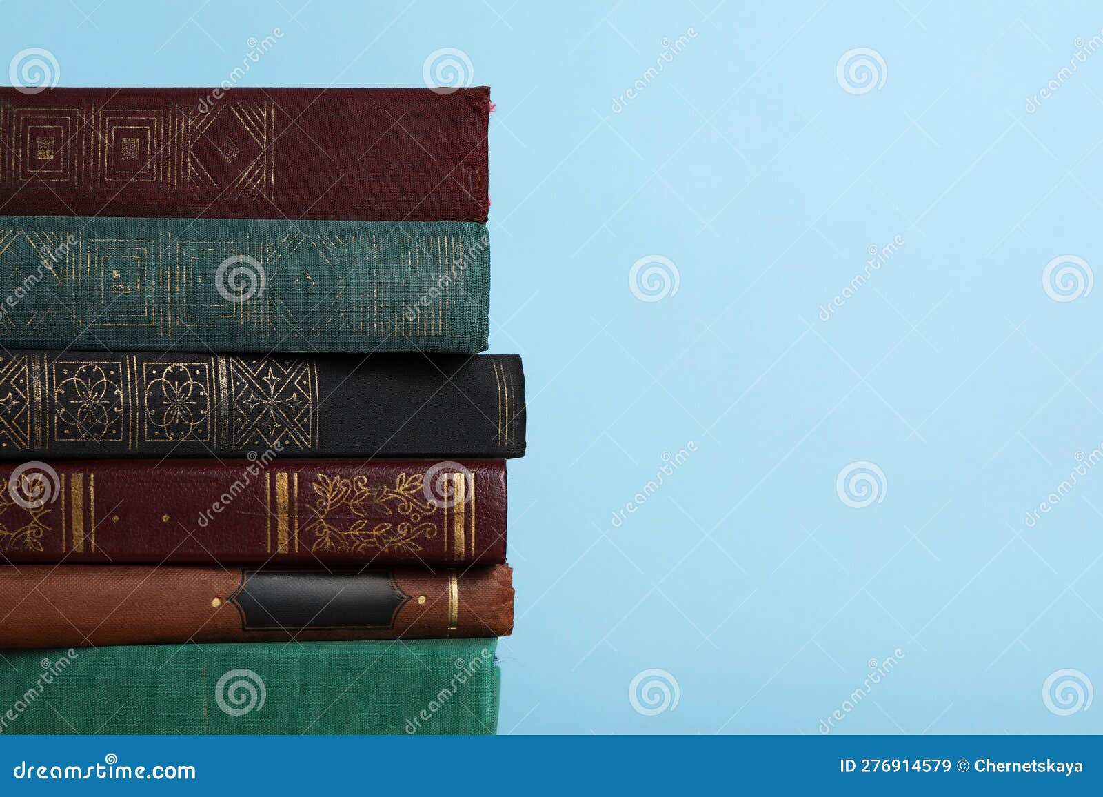 Stack of Old Books on Light Blue Background, Space for Text Stock Image ...
