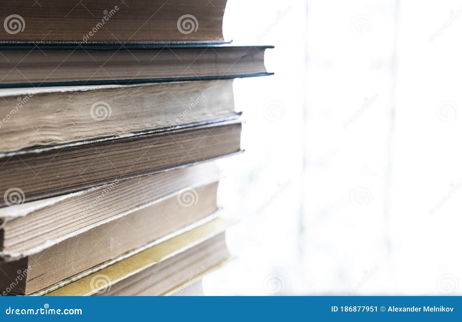 A Stack of Old Books Lying on a Windowsill Stock Image - Image of book ...