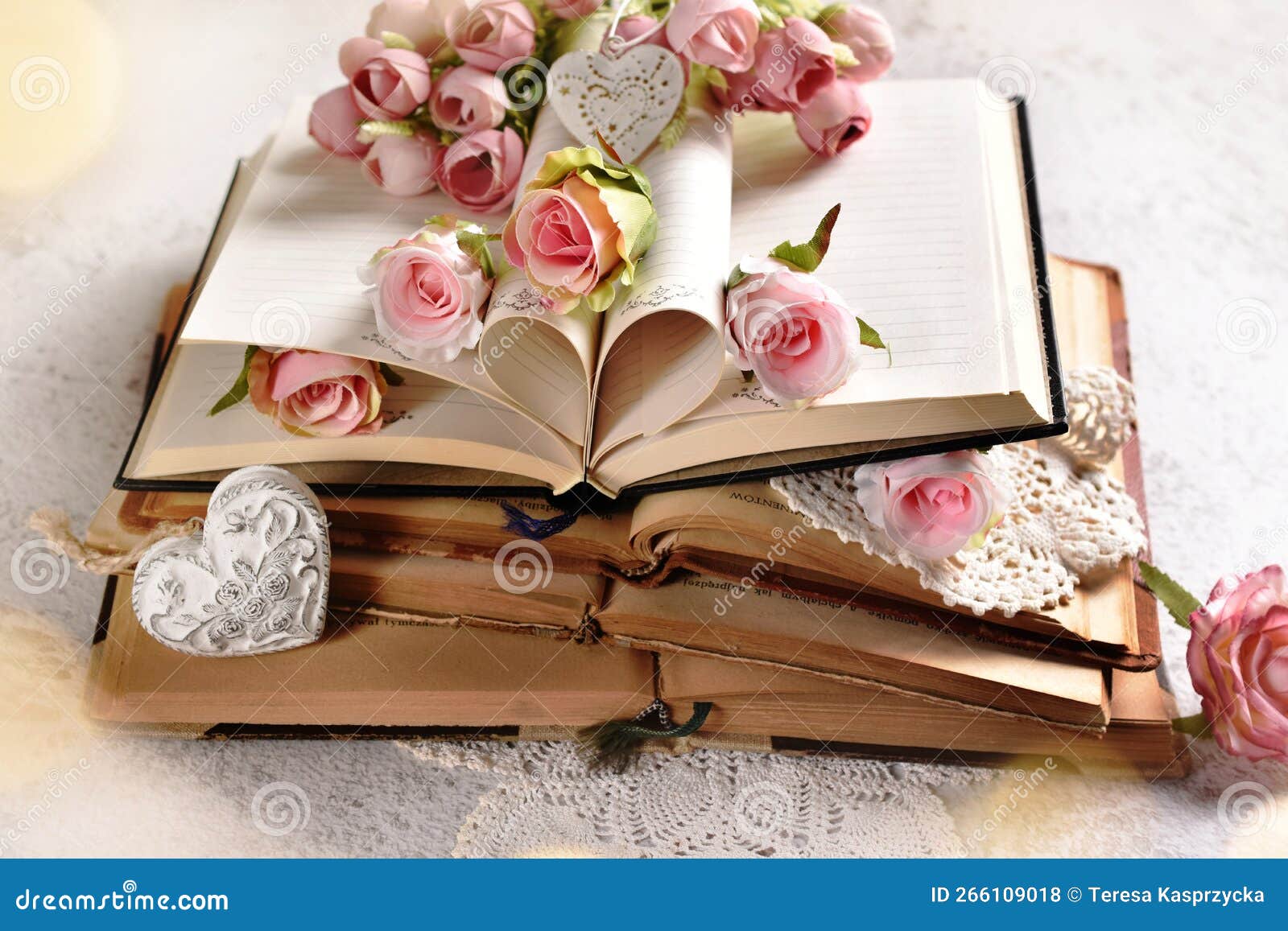 A Stack of Old Books with Pink Roses and Heart Decors Stock Photo ...