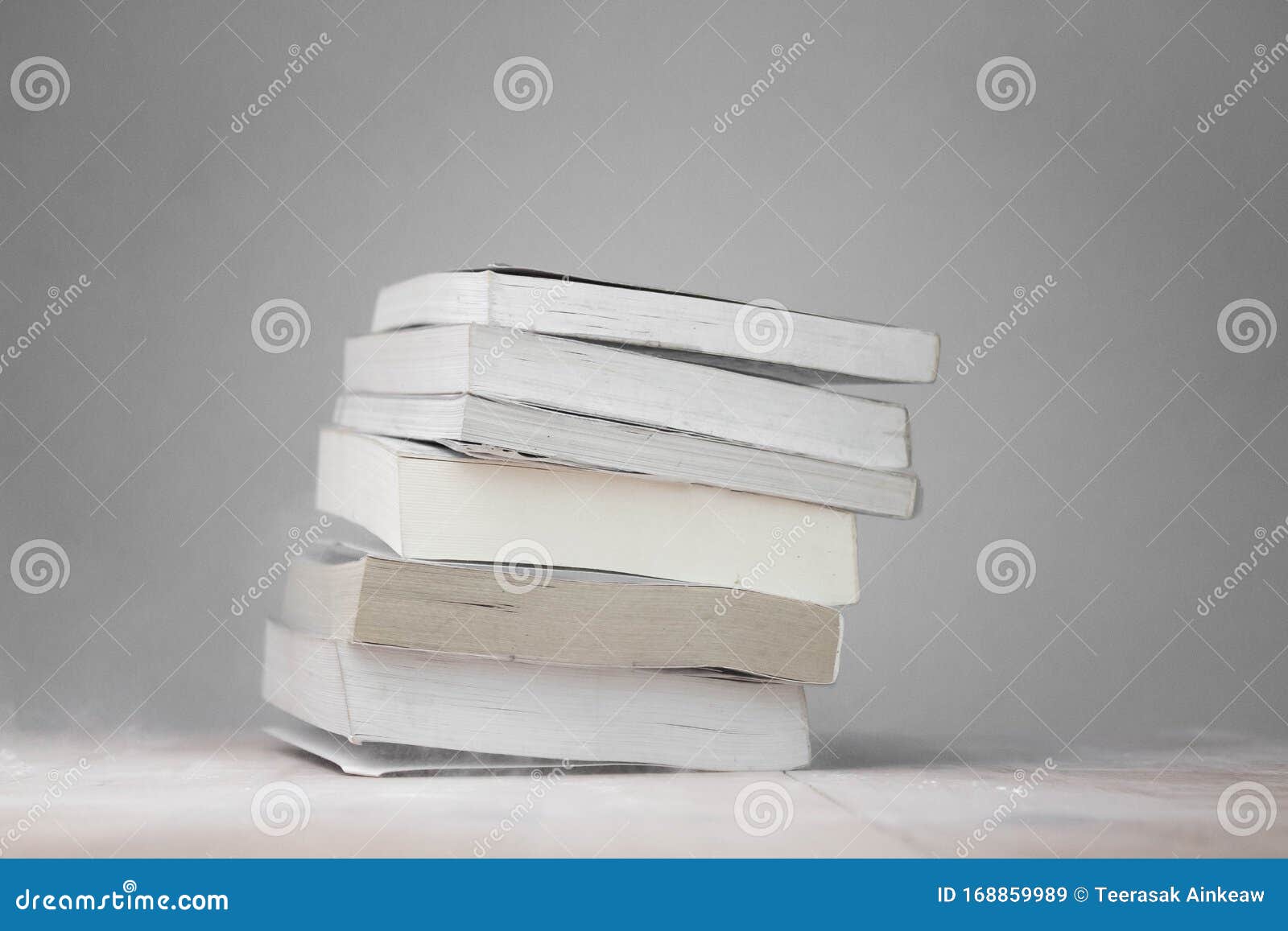 A Stack of Old Books Resting on a Dusty Desk in Room Stock Image ...