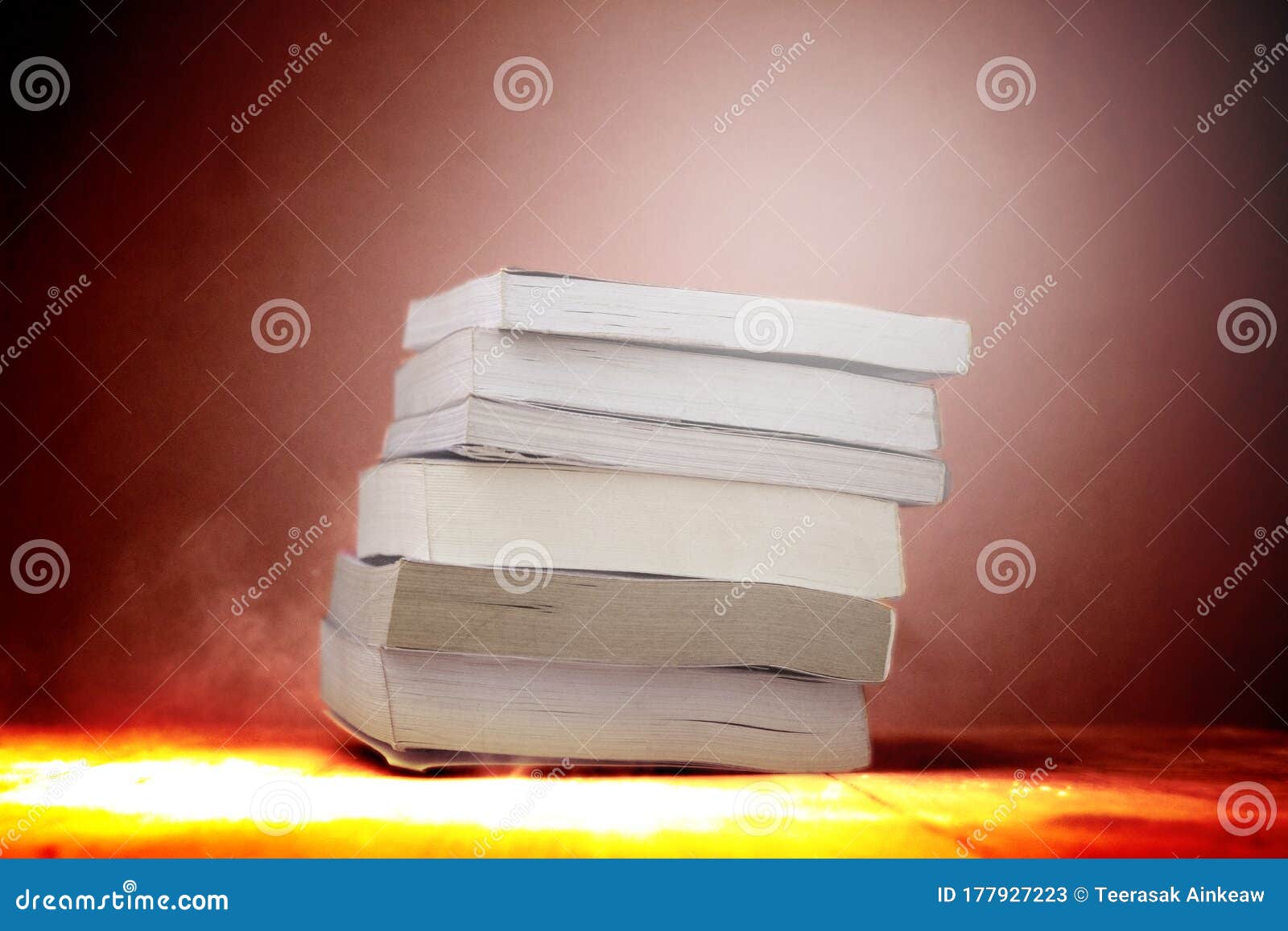 A Stack of Old Books Resting on a Dusty Desk in Room. Stock Image ...