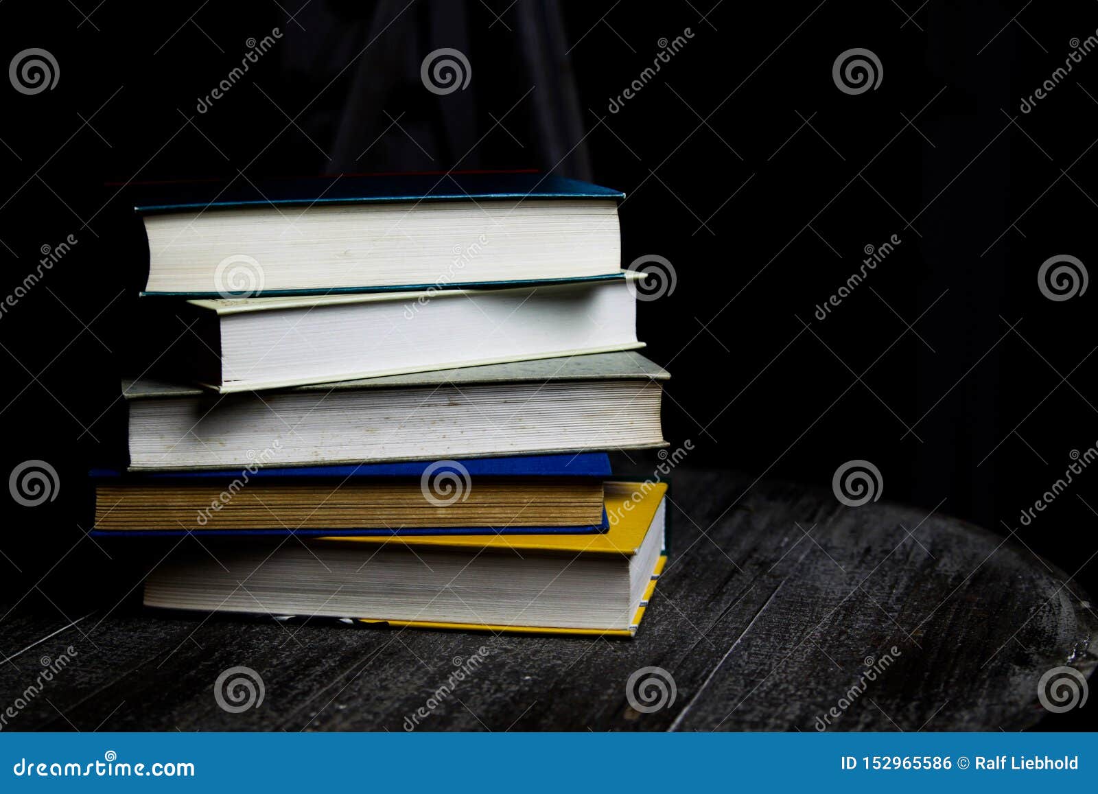 Stack of Old Books on Round Wood Table with Reading Light during Night ...