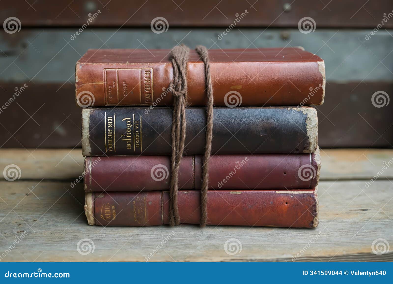A Stack of Old Books Tied Up with a Rope Stock Photo - Image of label ...