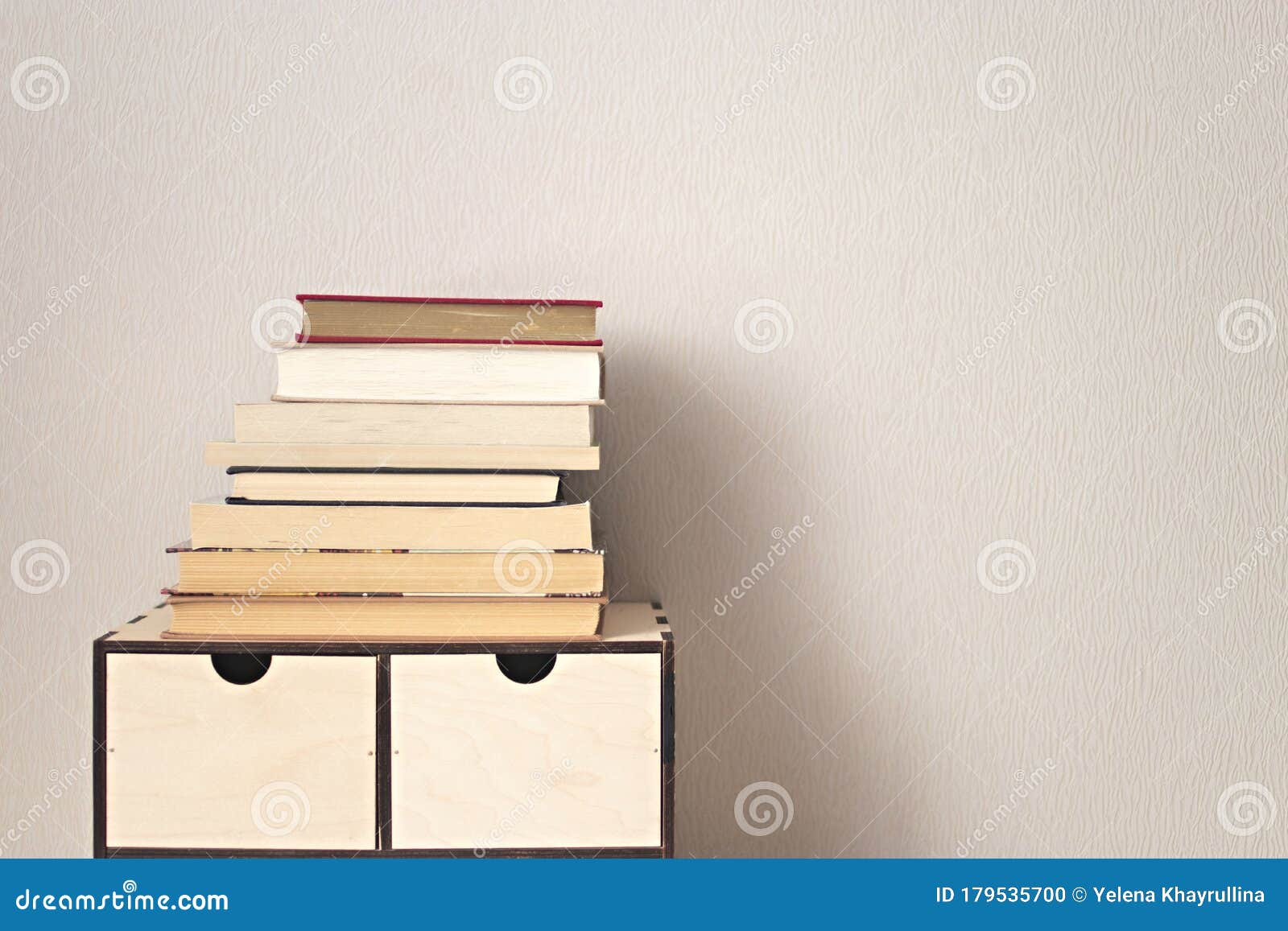 Stack of Old Books on a Wooden Chest of Drawers Stock Photo - Image of ...