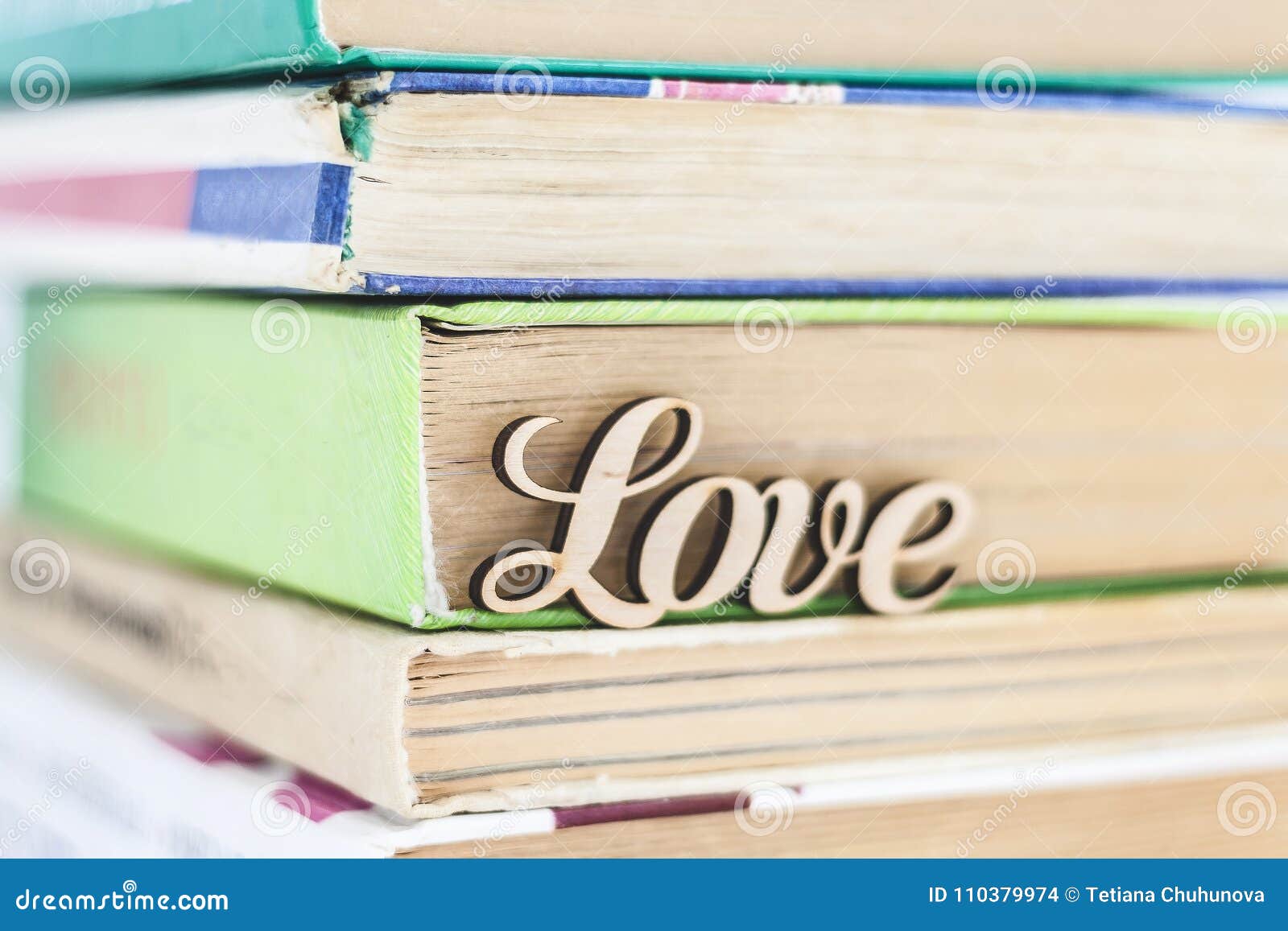 On a Stack of Old Books Wooden Word Love Stock Photo - Image of ...