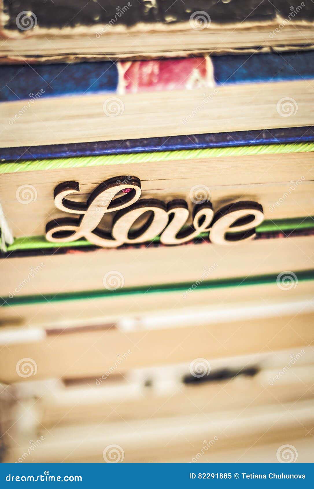 On a Stack of Old Books Wooden Word Love Stock Image - Image of design ...