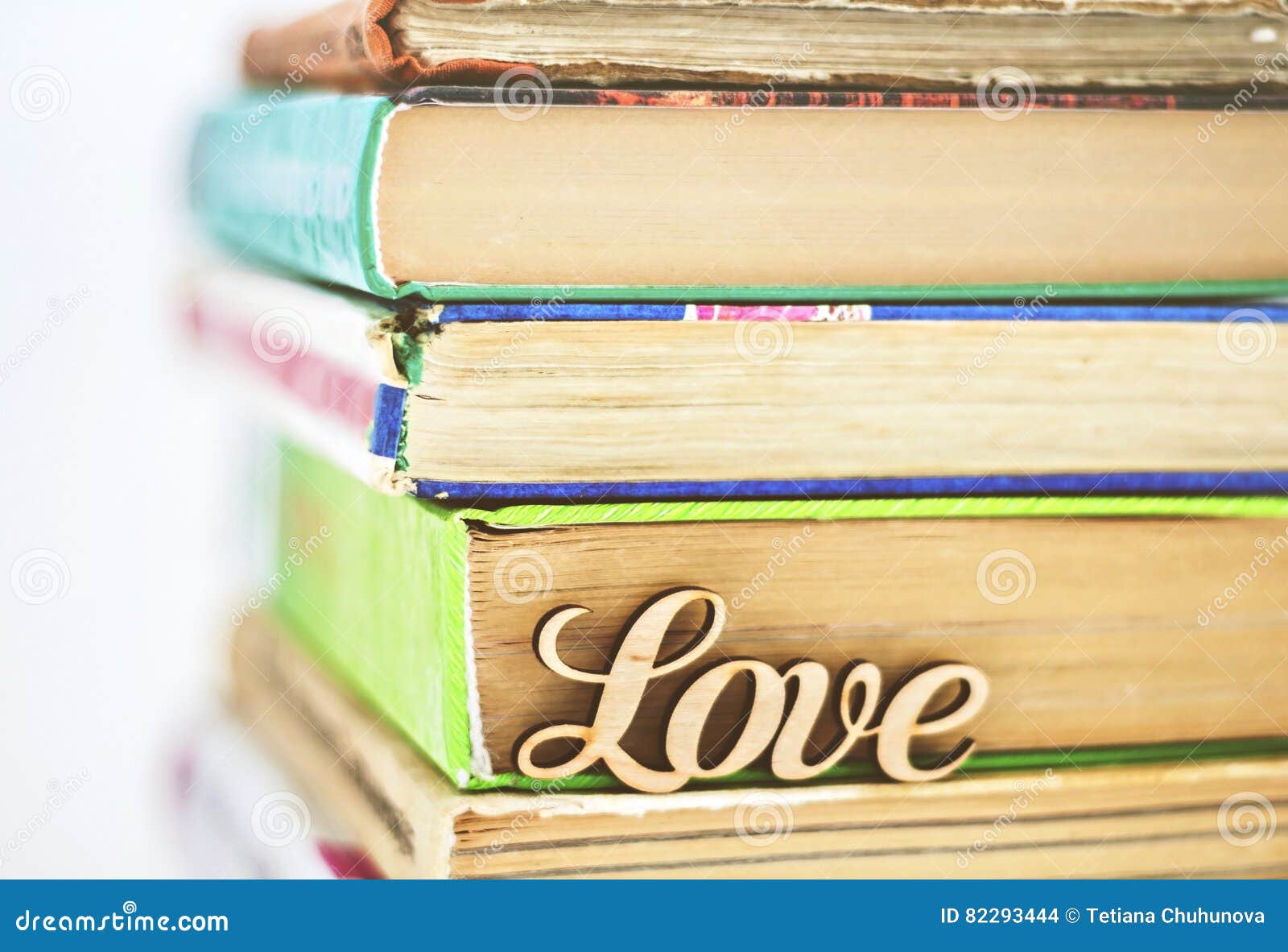 On a Stack of Old Books Wooden Word Love Stock Photo - Image of concept ...