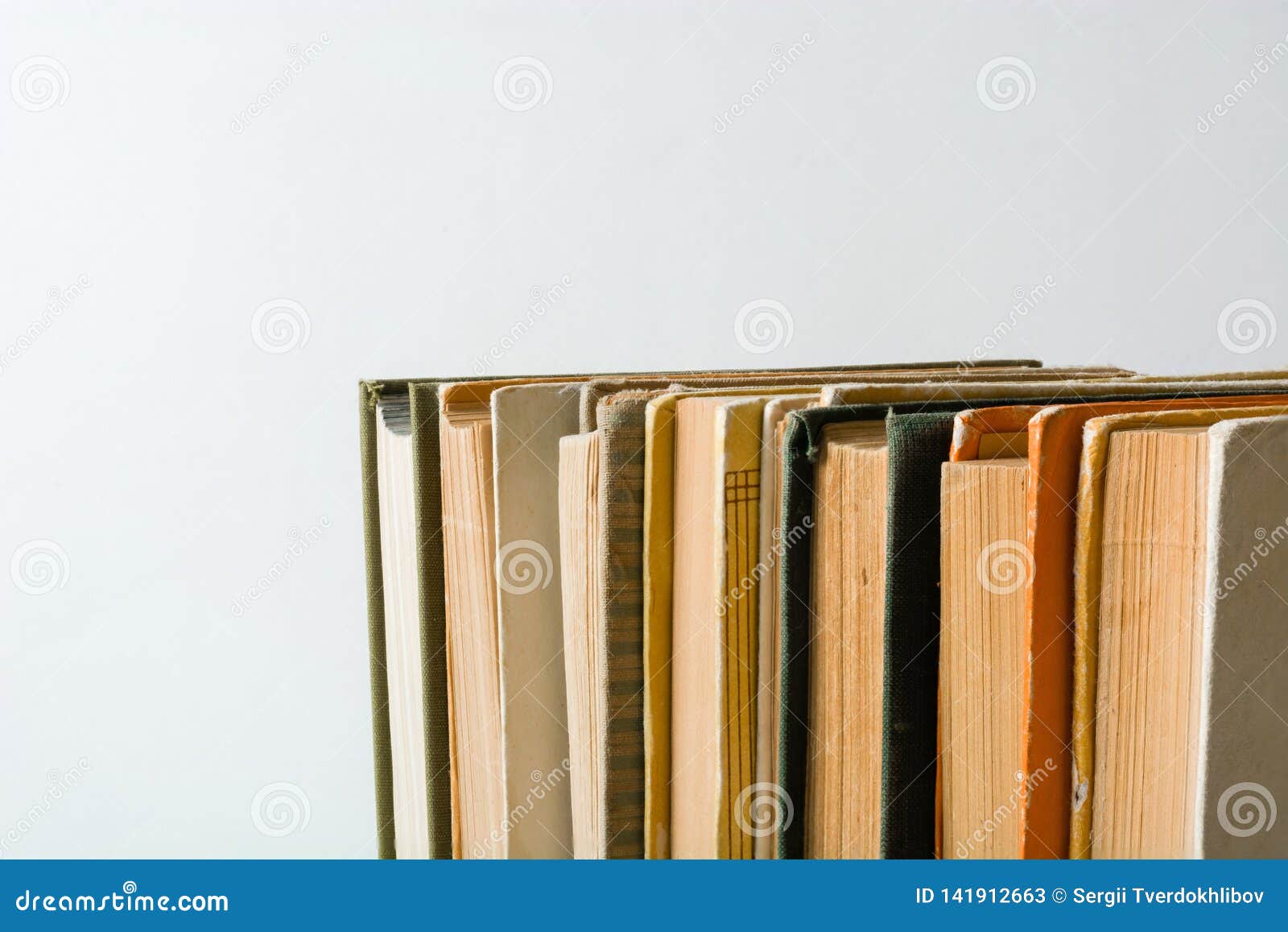 A Stack of Old Books. Yellow Frayed Pages. Worn Damaged Book Covers ...