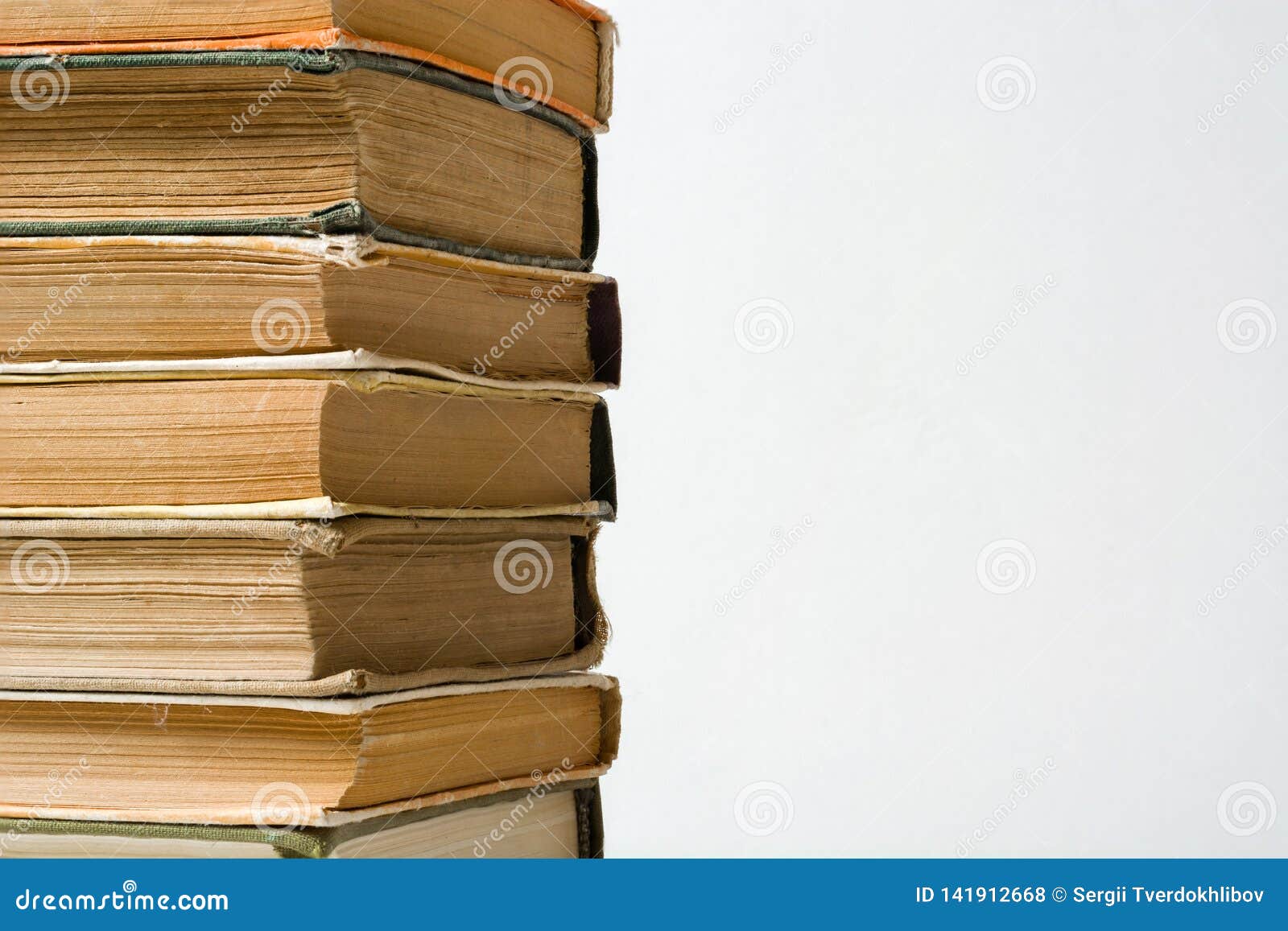 A Stack of Old Books. Yellow Frayed Pages. Worn Damaged Book Covers ...