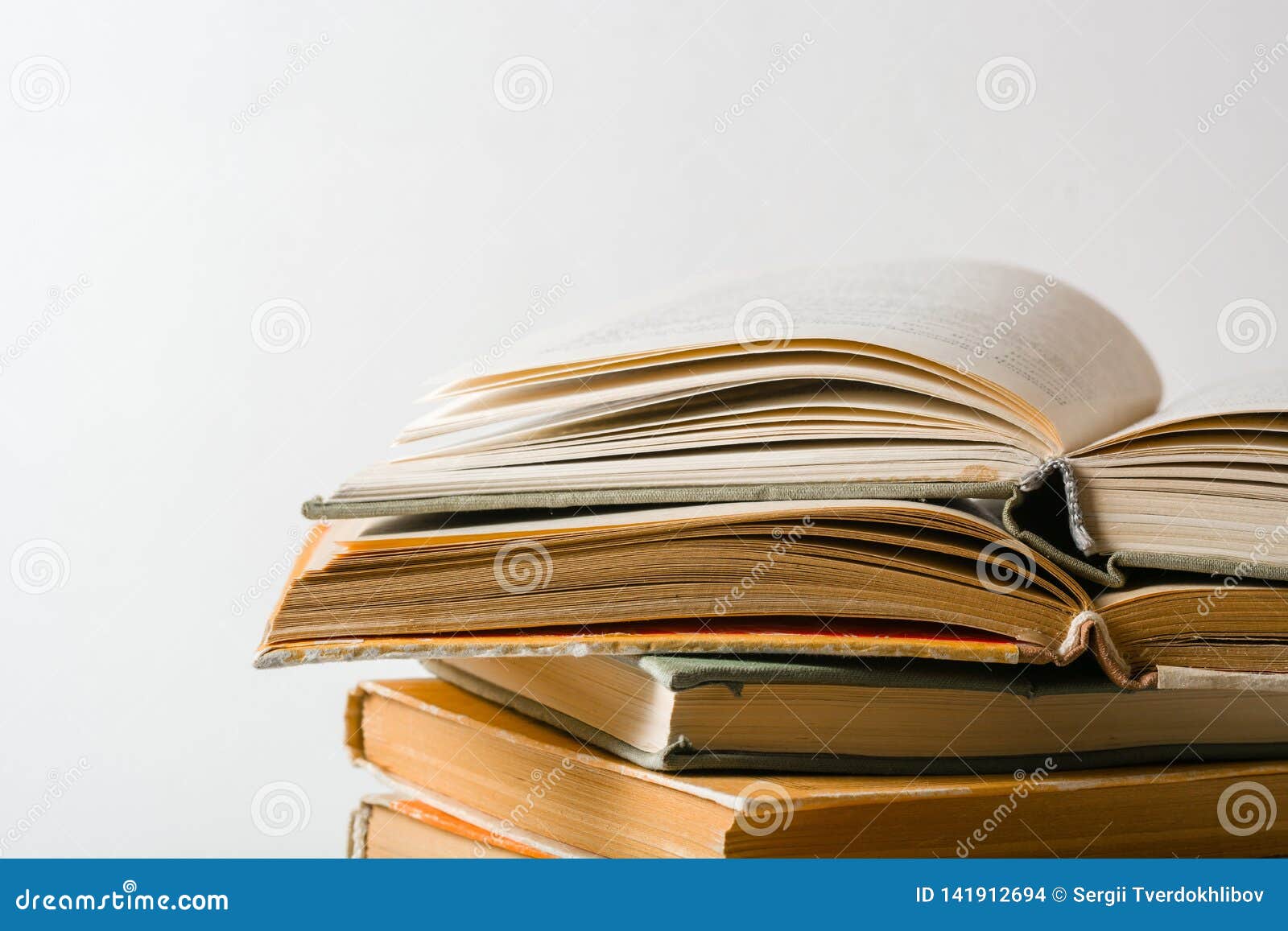 A Stack of Old Books. Yellow Frayed Pages. Worn Damaged Book Covers ...