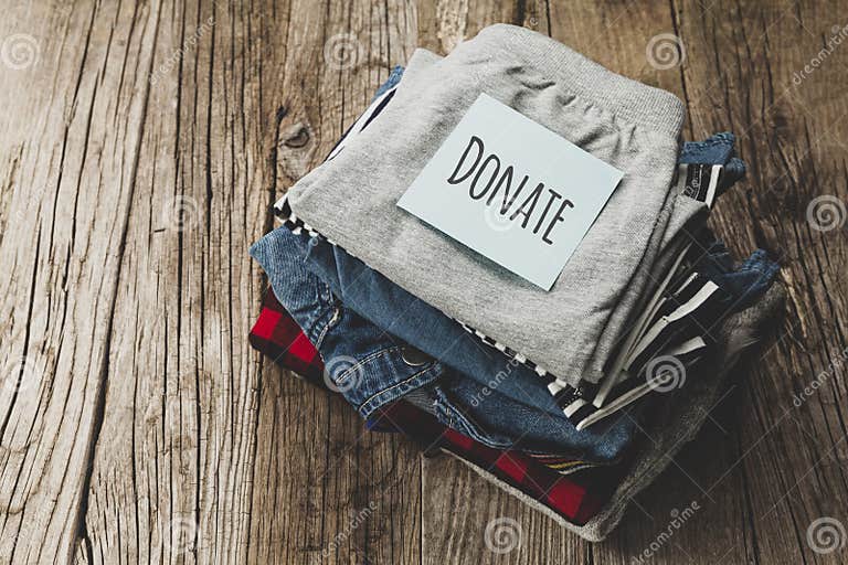 Stack of Old Clothes To Discard Declutter or Donate. Recycling Fabric ...