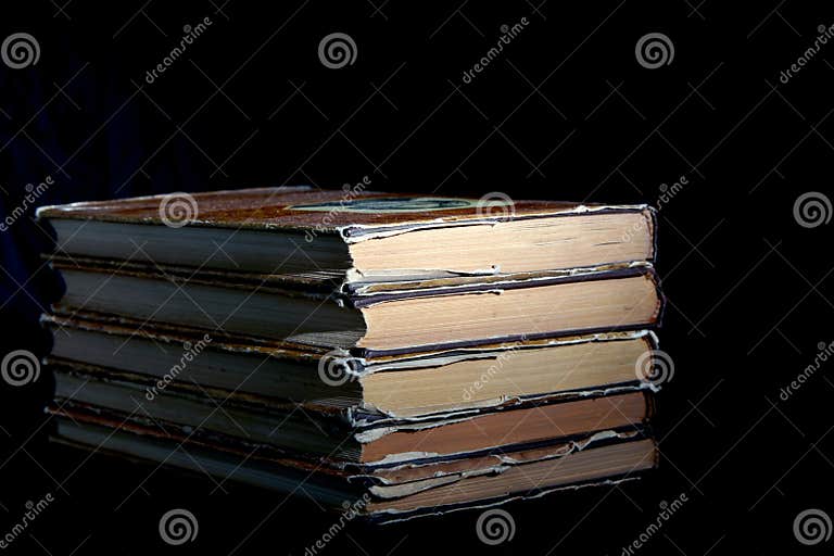 A Stack of Old Dusty Books on a Dark Background Stock Image - Image of ...