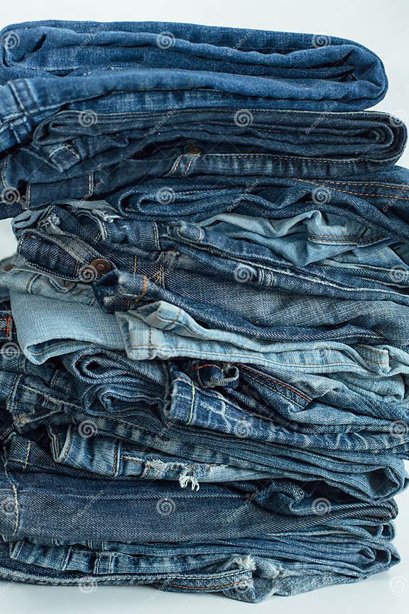 Stack of a Stack of Old Jeans Various Shades of Blue Jeans. Denim Jeans ...